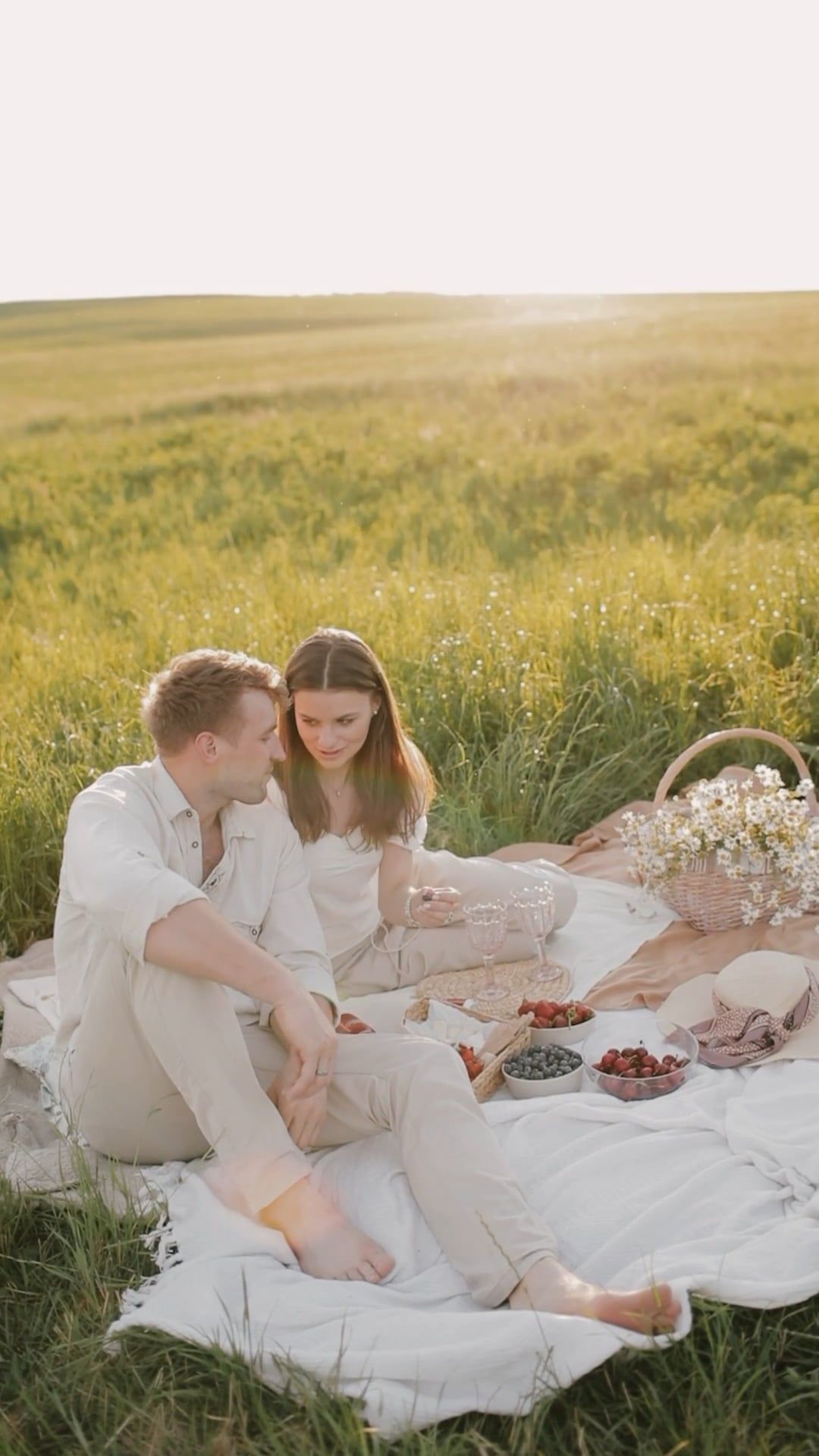A Couple Having a Picnic In A Grass Field · Free Stock Video