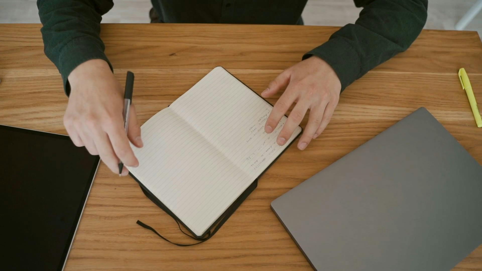 A Person Writing on a Notebook · Free Stock Video