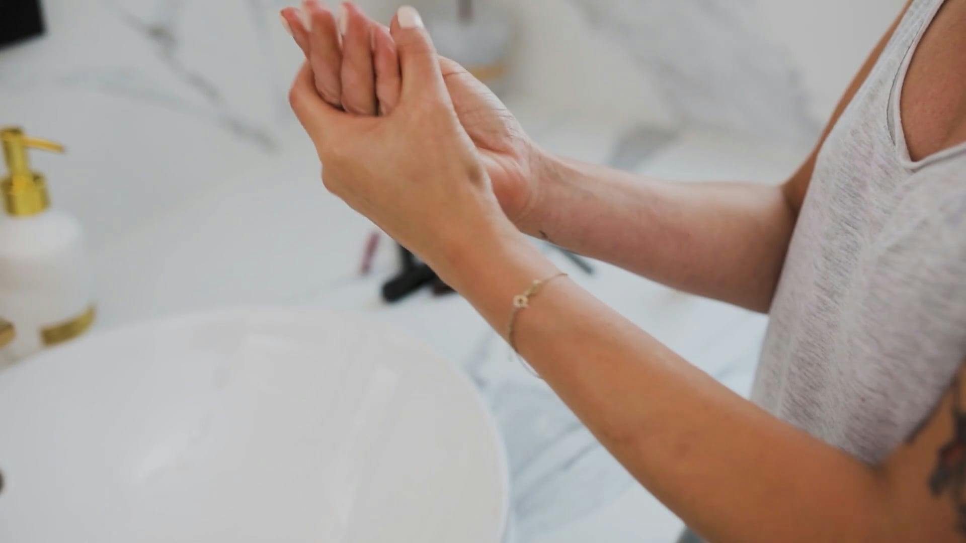 Person Applying a Lotion on Her Hands · Free Stock Video