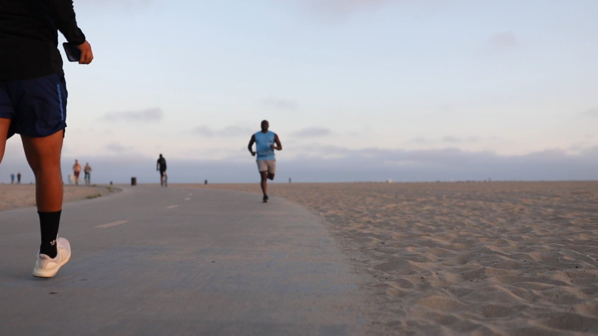 People Jogging on the Seaside · Free Stock Video