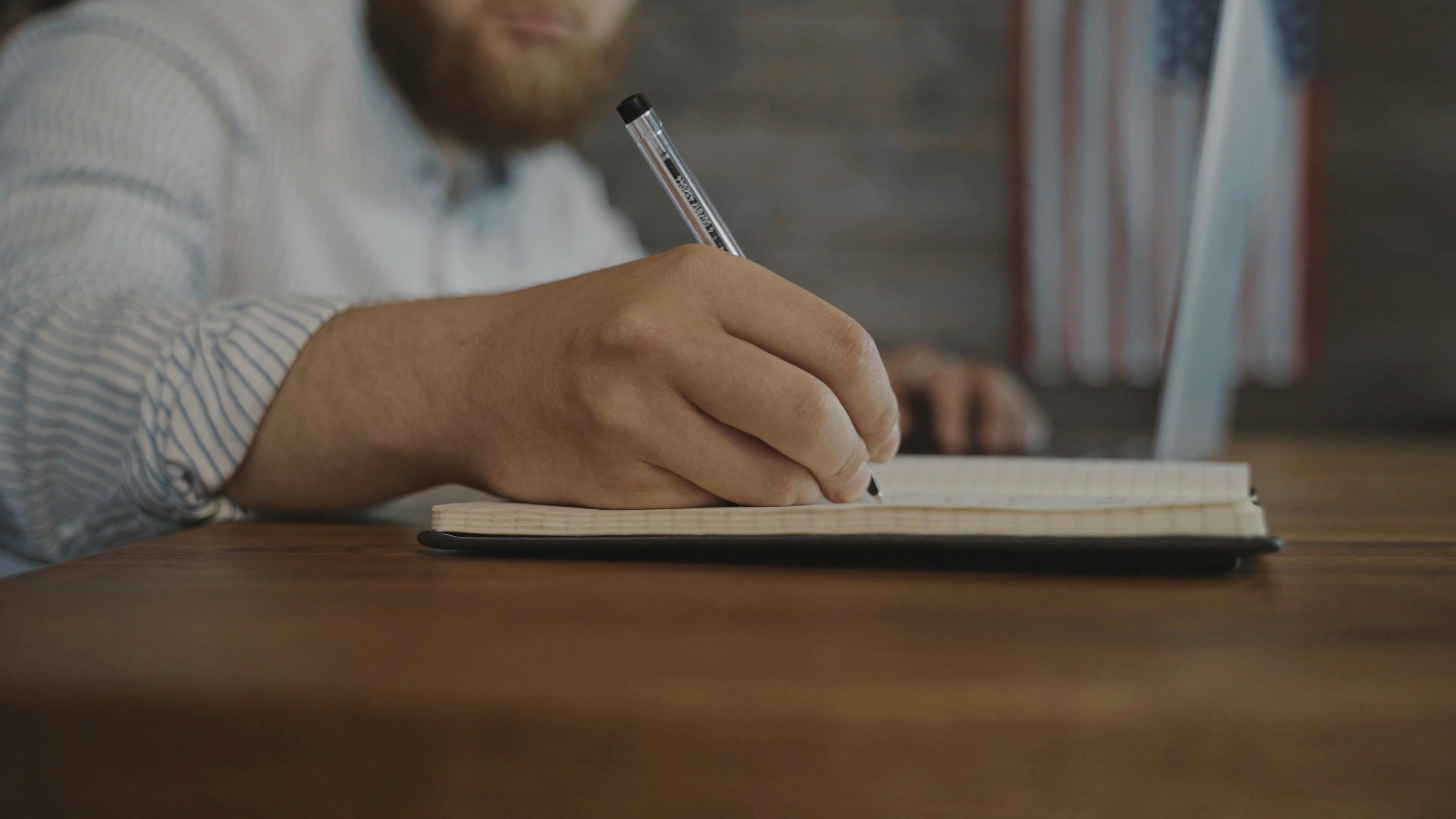 Person Writing on the Notebook · Free Stock Video Person Writing on the Notebook · Free Stock Video