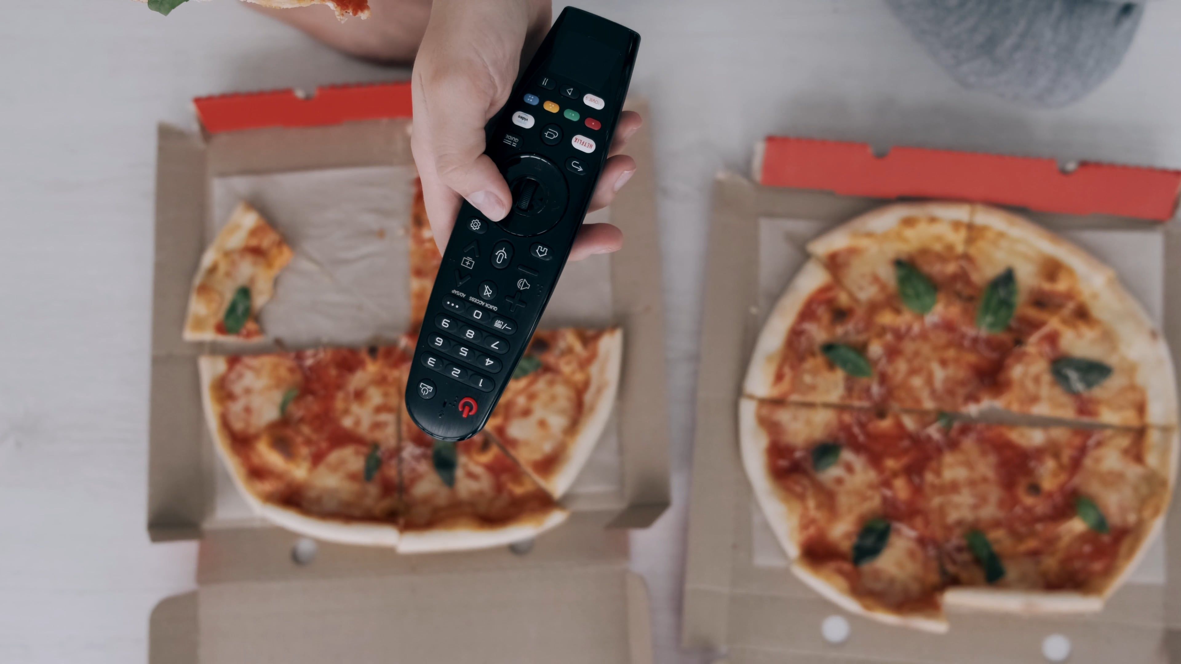 Person Holding A Remote And Pizza Free Stock Video Footage, Royalty ...