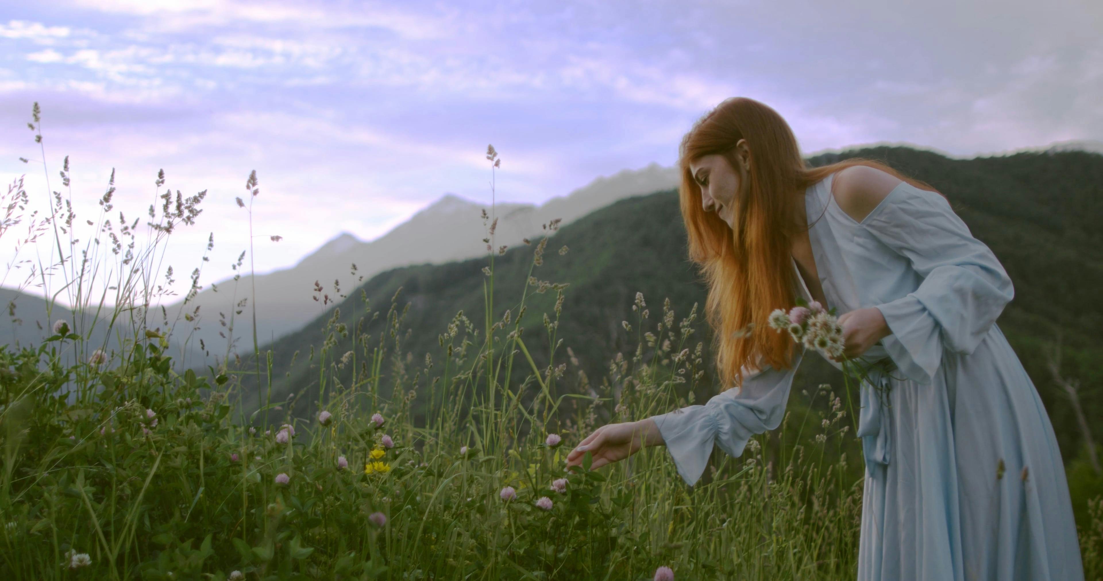 Footage Of A Woman Running In The Field Full Of Flowers Free Stock ...