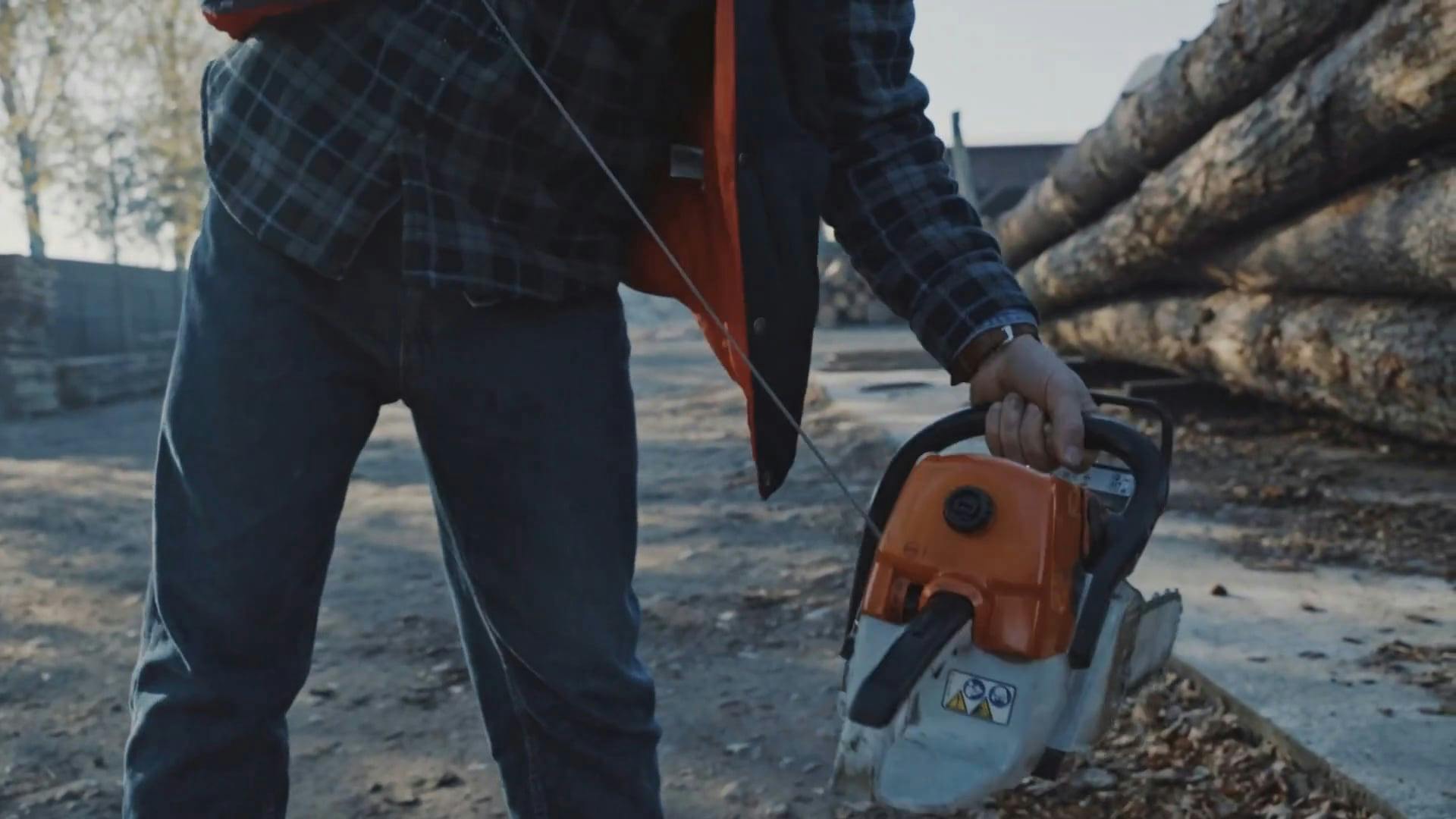 Man Cutting Log With Chainsaw · Free Stock Video