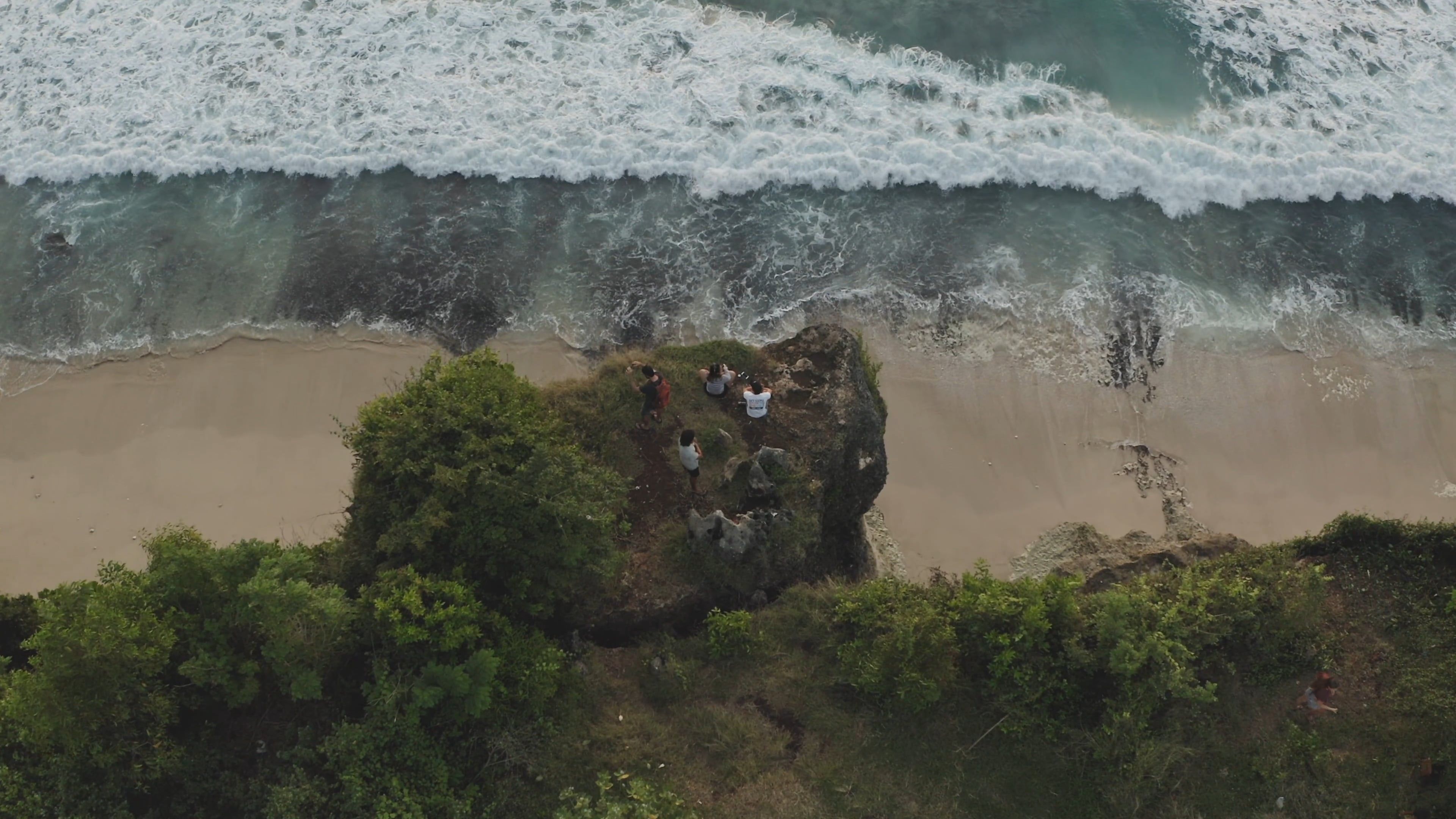 People Chilling at the Edge of a Cliff by the Beach Free Stock Video ...