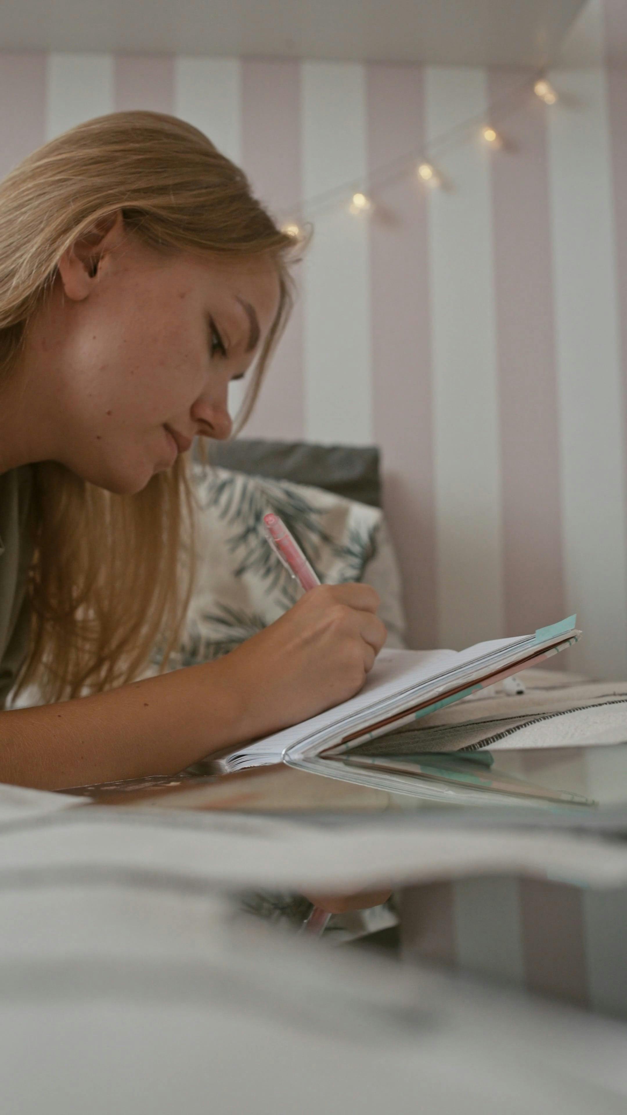 Woman Writing a Notes While Browsing Her Tablet Free Stock Video ...