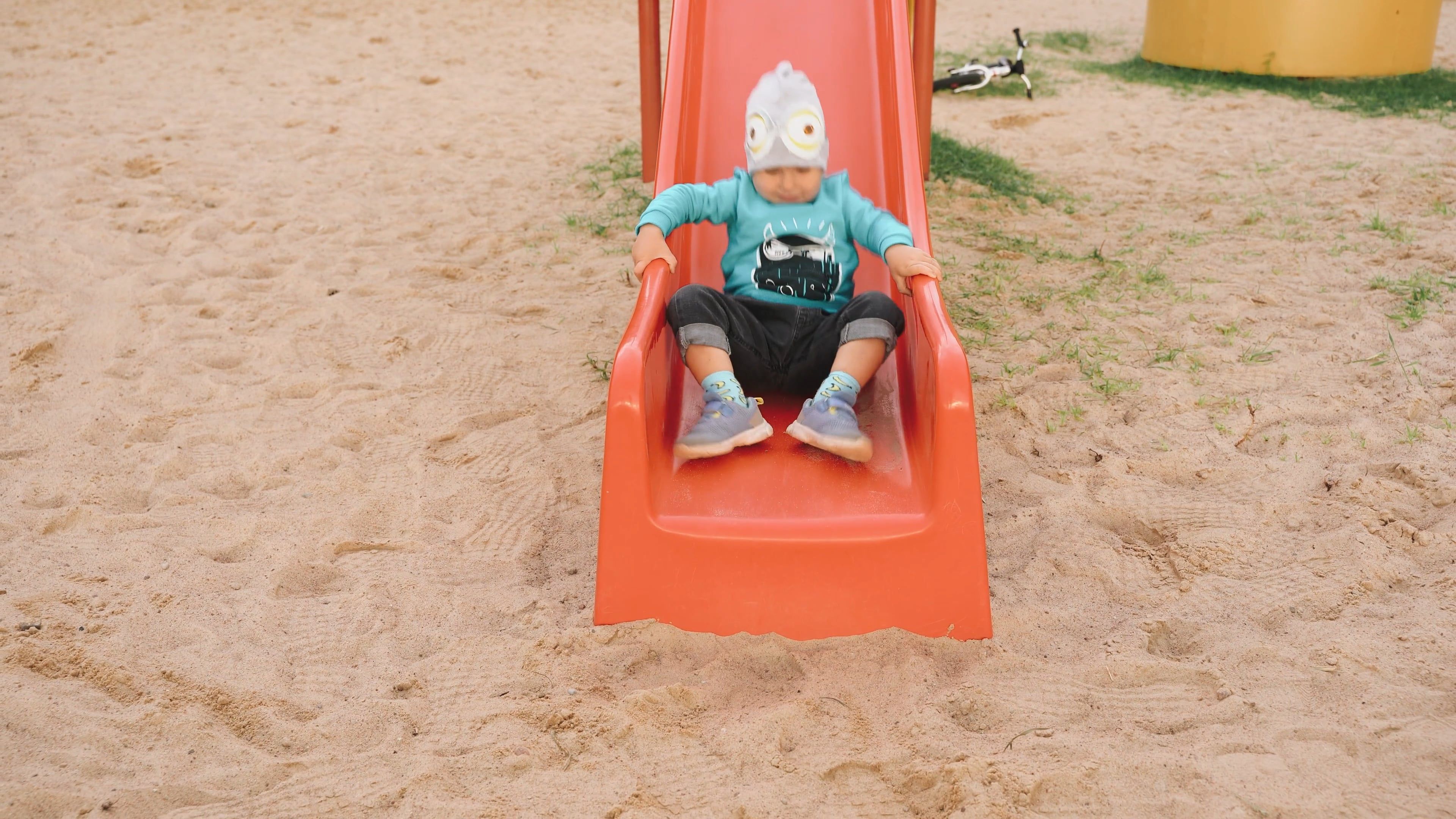 Boy Sliding Down the Slide at the Park · Free Stock Video