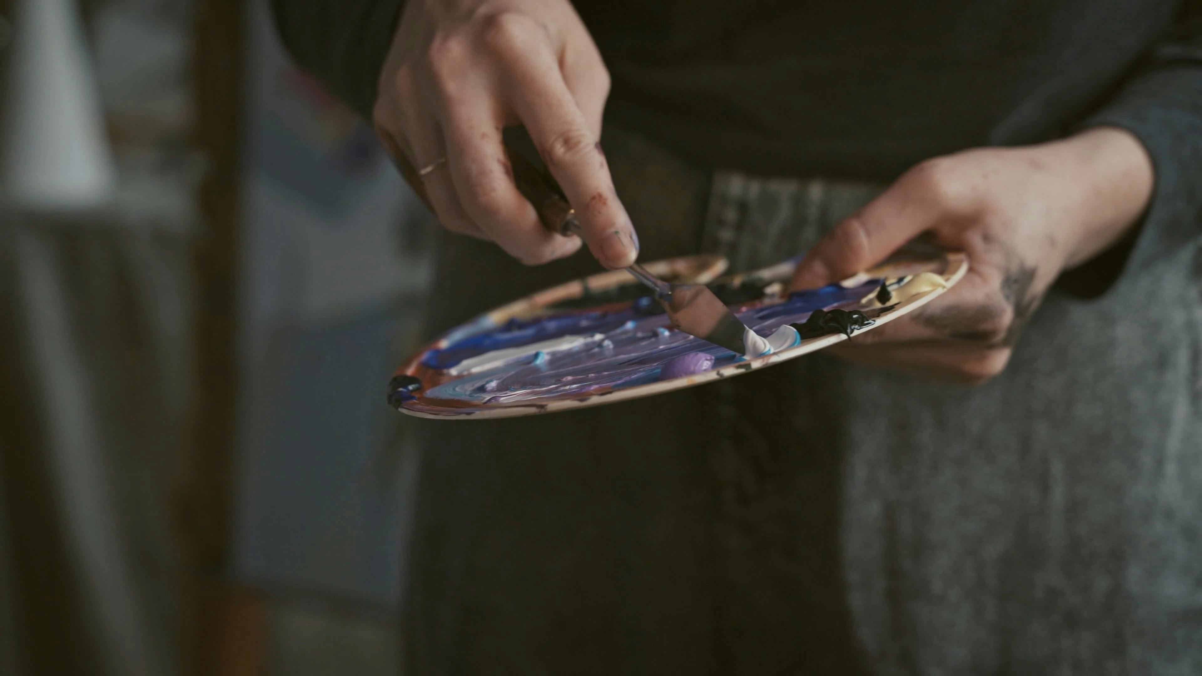 A Person Mixing Paints on a Palette · Free Stock Video