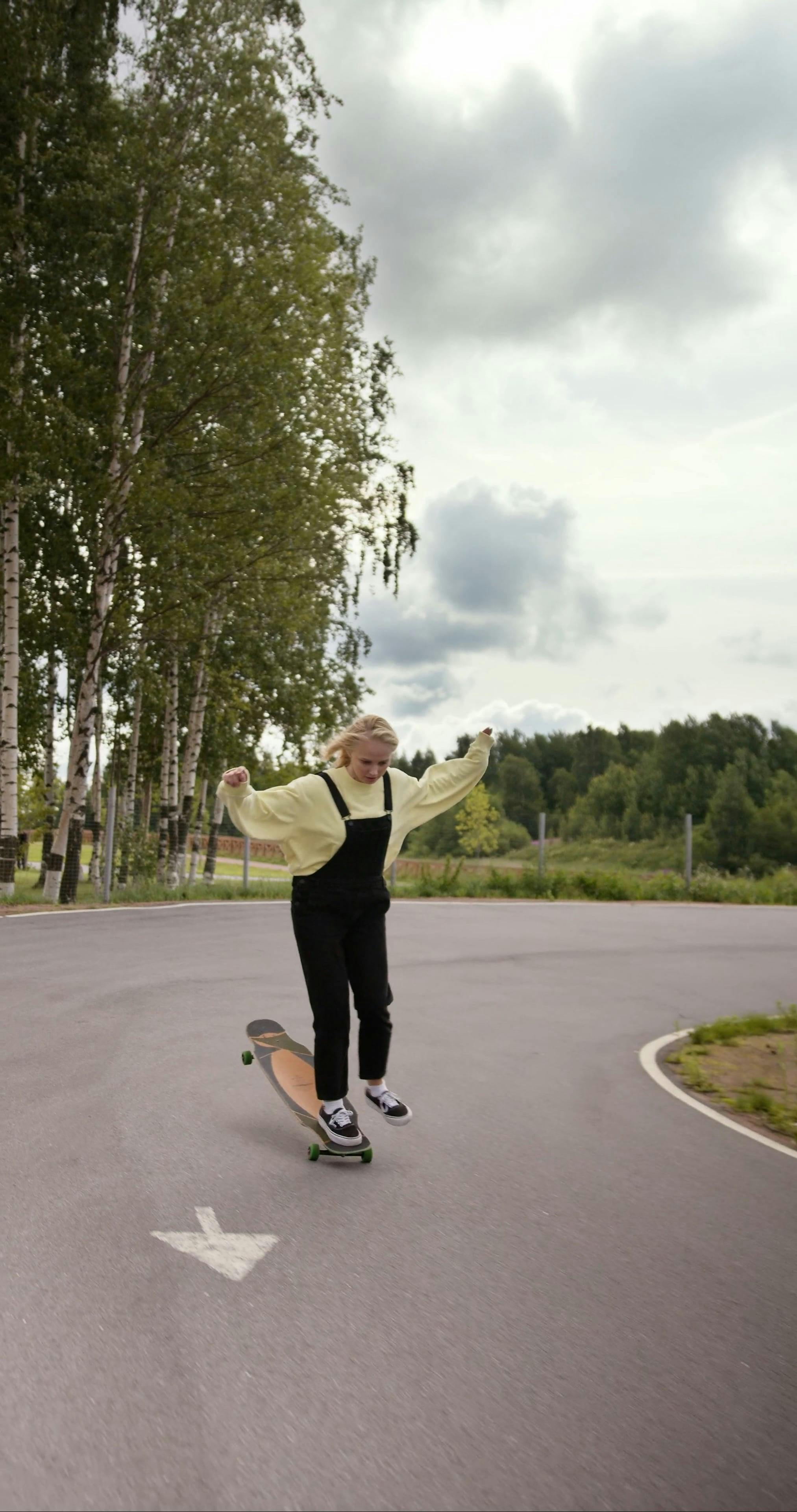 Woman Doing a Trick While Riding a Longboard · Free Stock Video