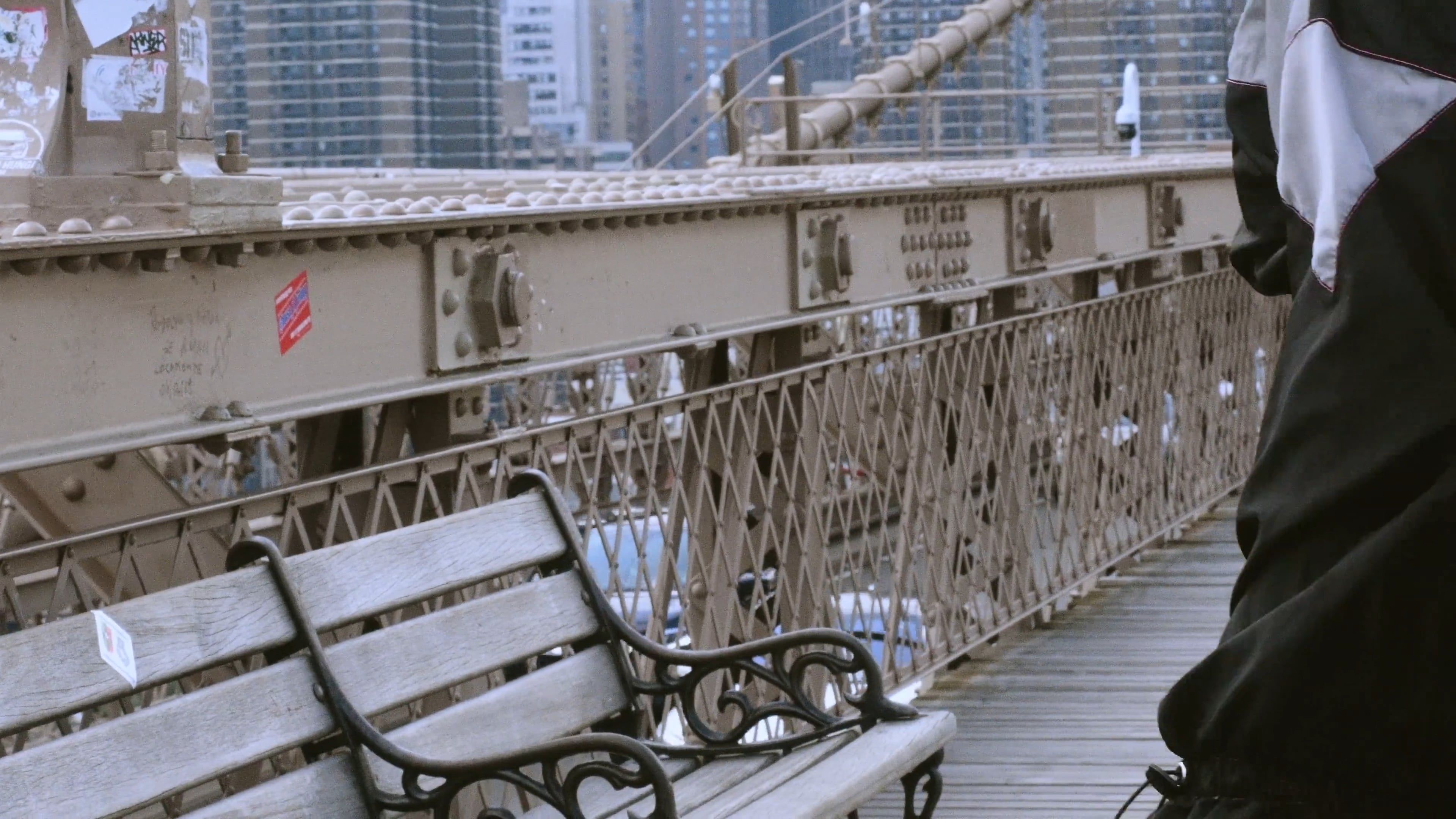 Woman Resting on the Bench at the Suspension Bridge Free Stock Video ...