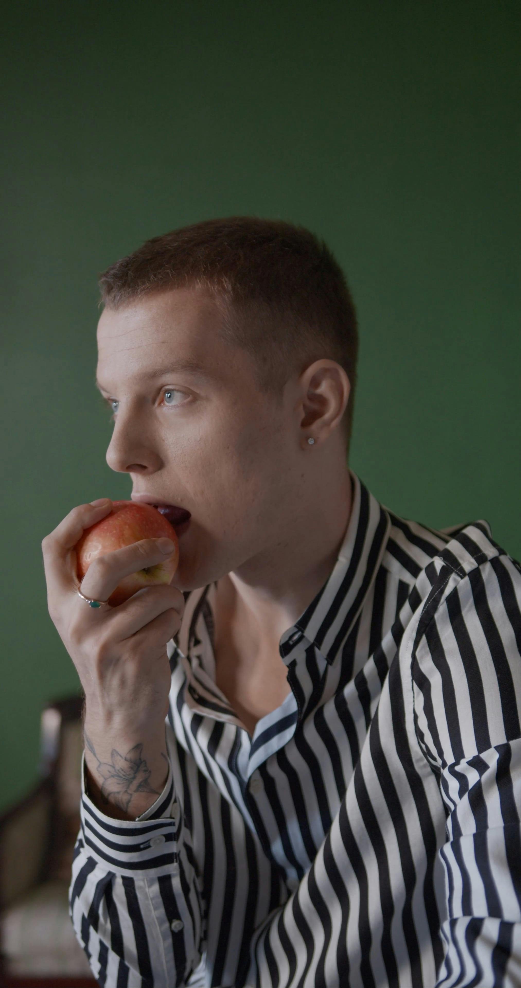 A Young Man Eating an Apple Free Stock Video Footage, Royalty-Free 4K ...