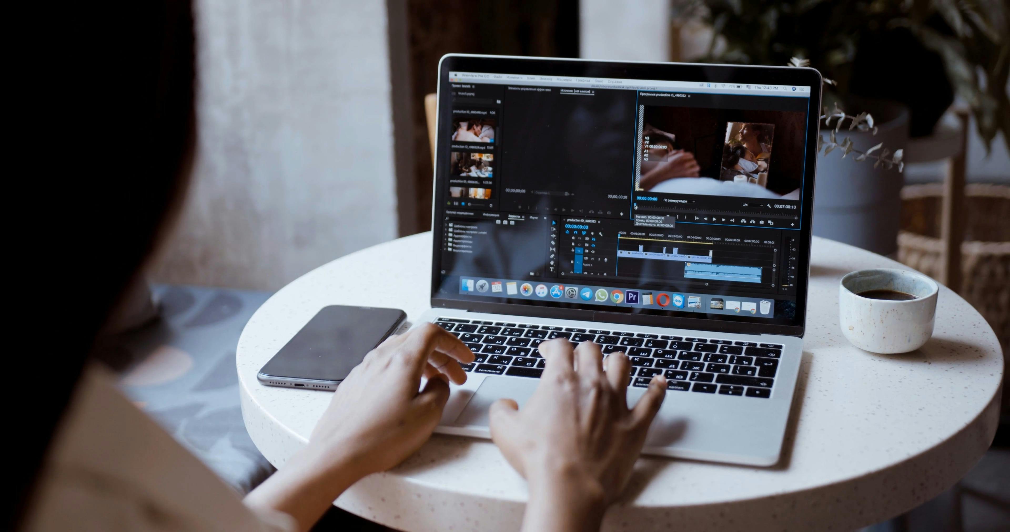 A person is using a laptop to edit video Free Stock Video Footage ...