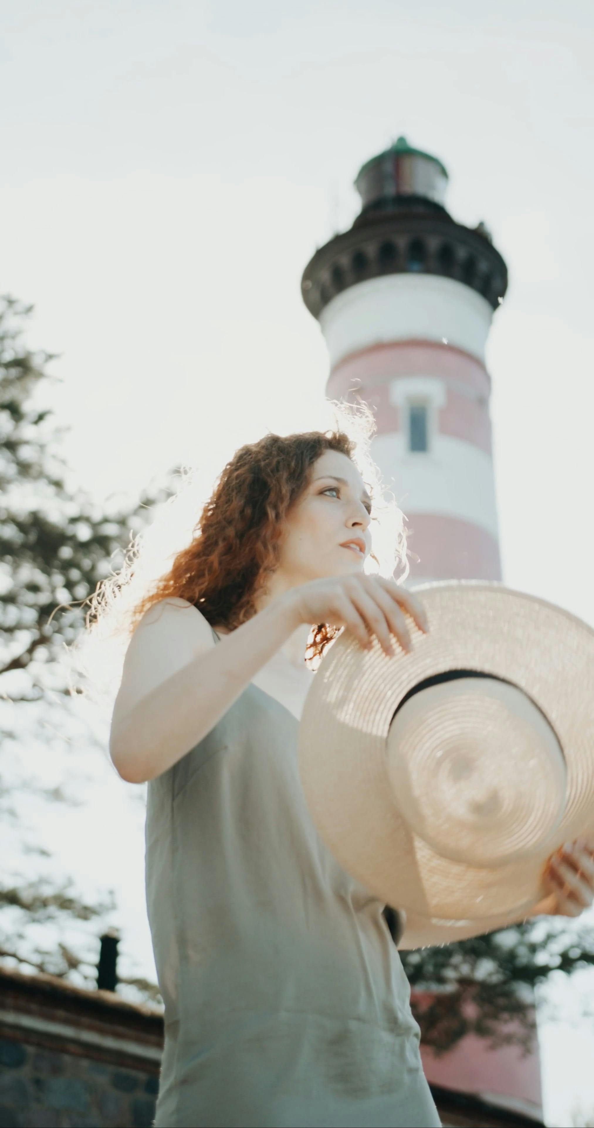 Woman Wearing Beach Hat Posing for the Camera · Free Stock Video