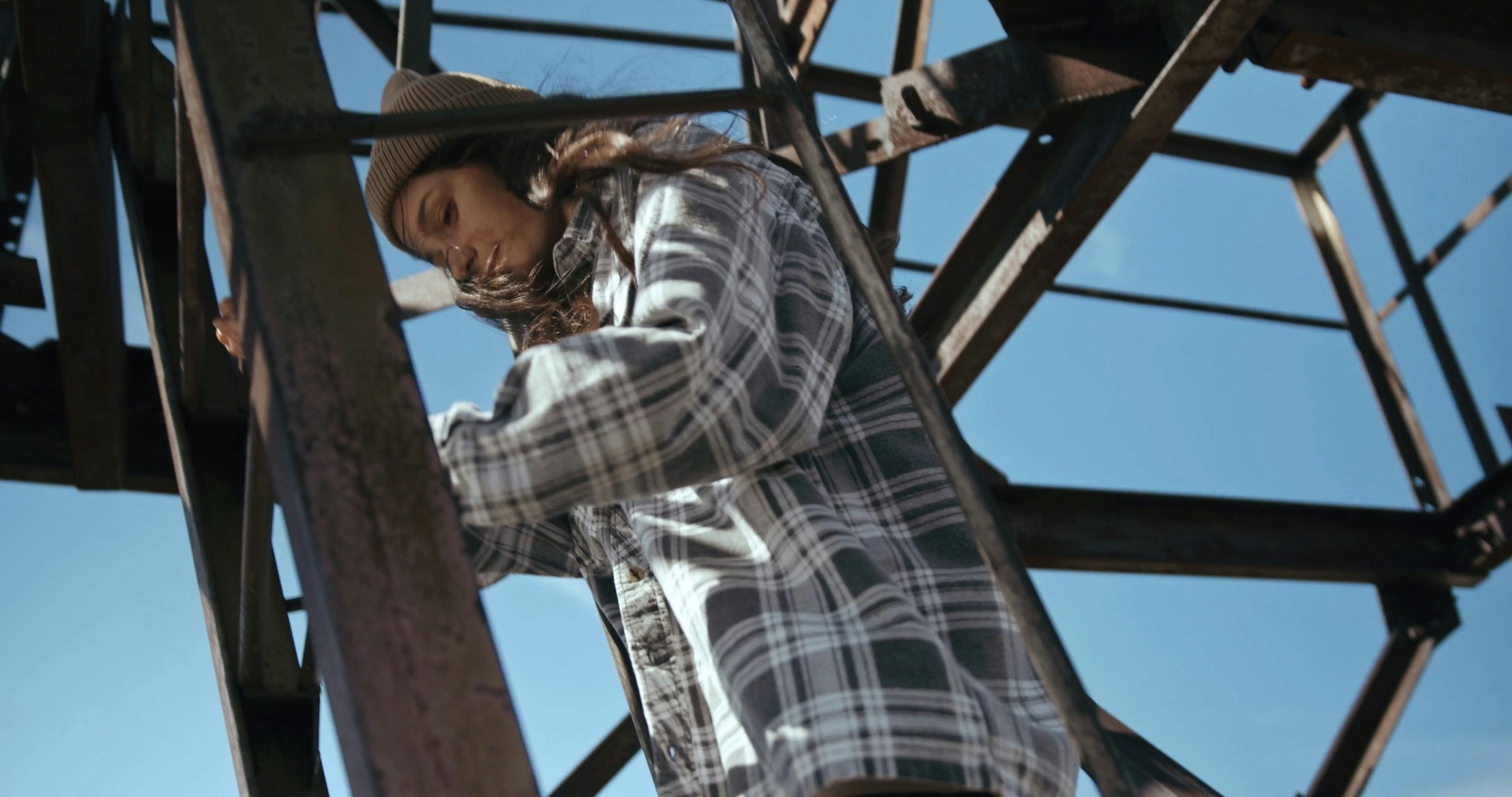 Woman Getting Down a Ladder · Free Stock Video