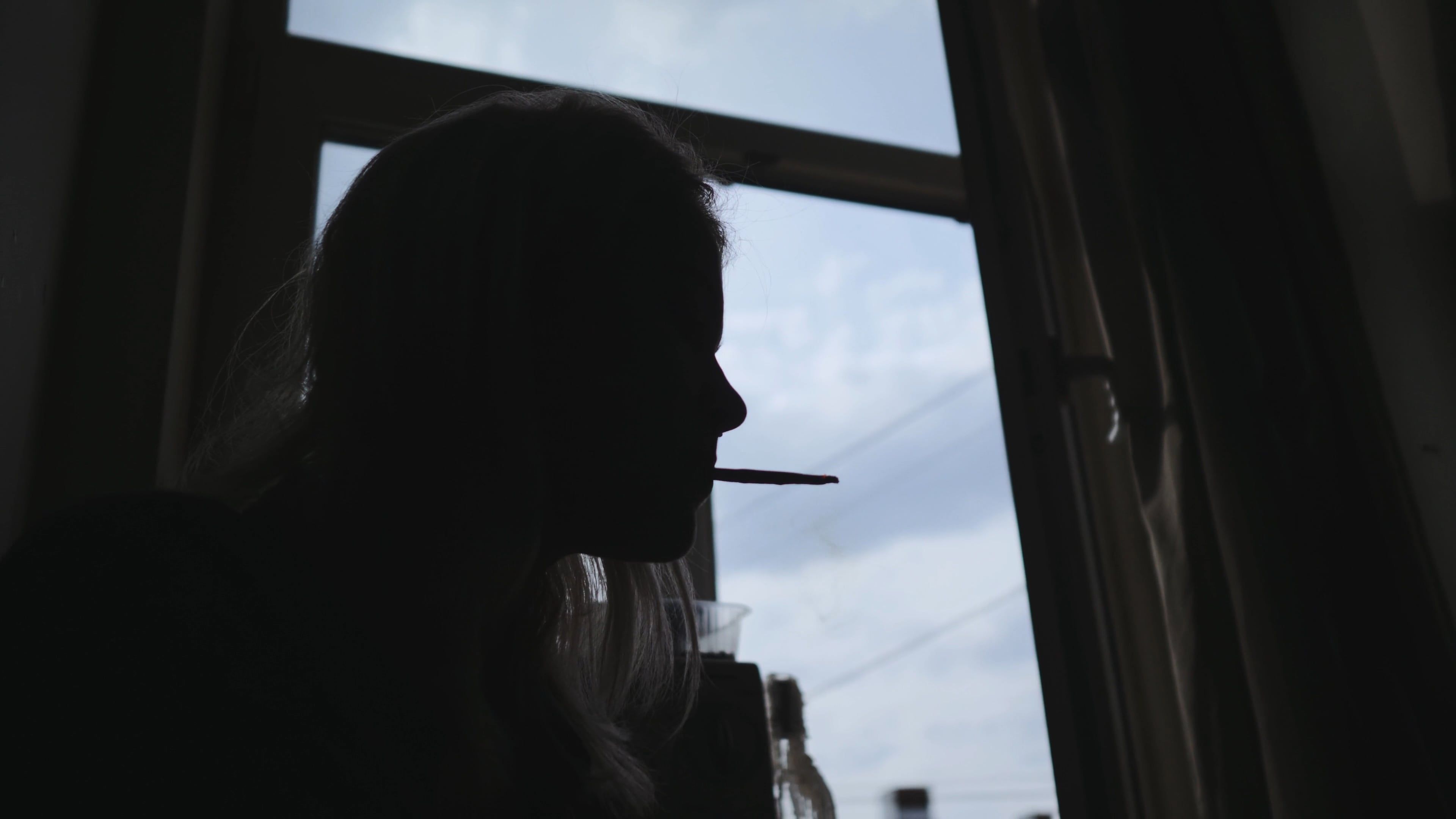 Woman Smoking Weed by the Window Free Stock Video Footage, Royalty-Free ...