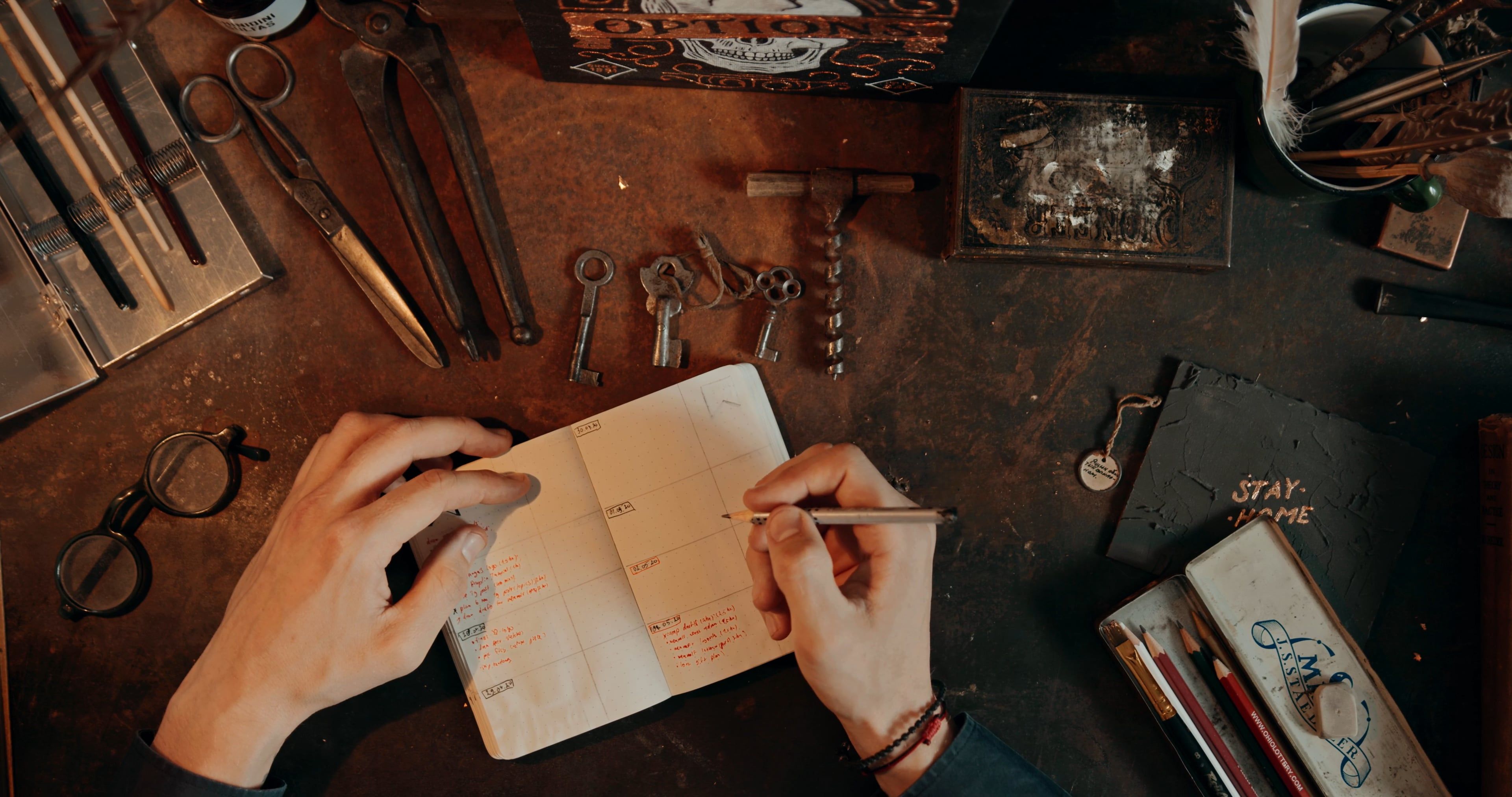 A person is writing on a table with a pen Free Stock Video Footage ...