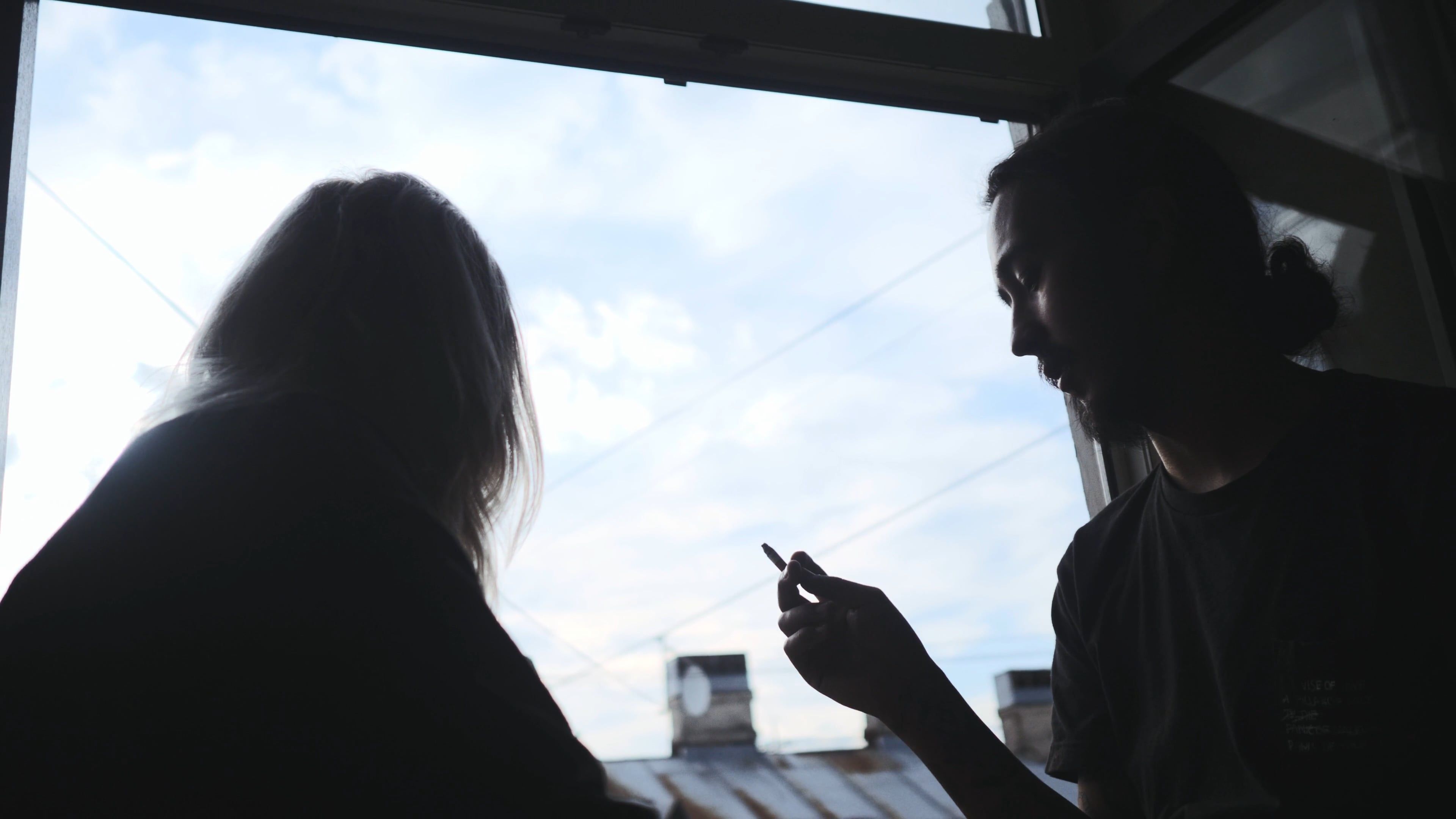 Man and Woman Smoking Cigarette by the Window Free Stock Video Footage ...