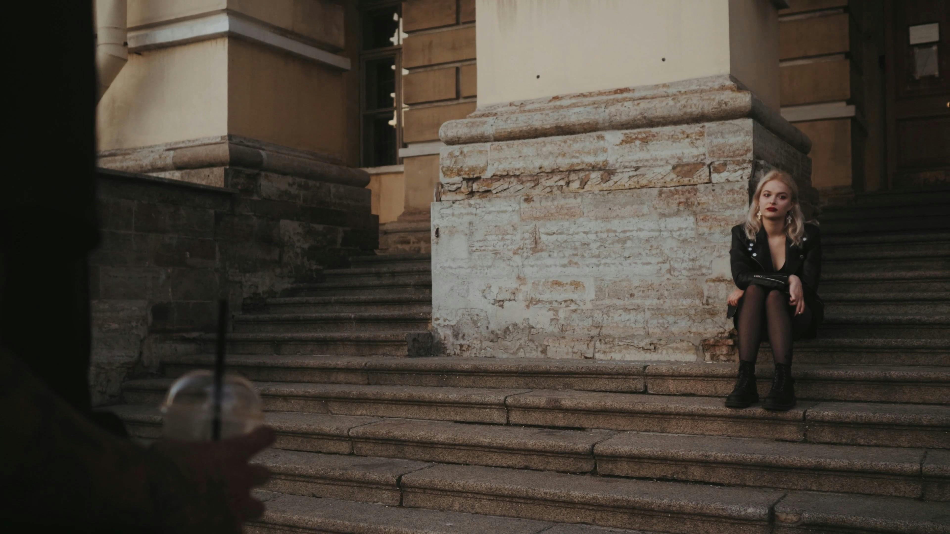 Smoking Girlfriend Sitting on Stairs and Boyfriend Joins Her Free Stock ...