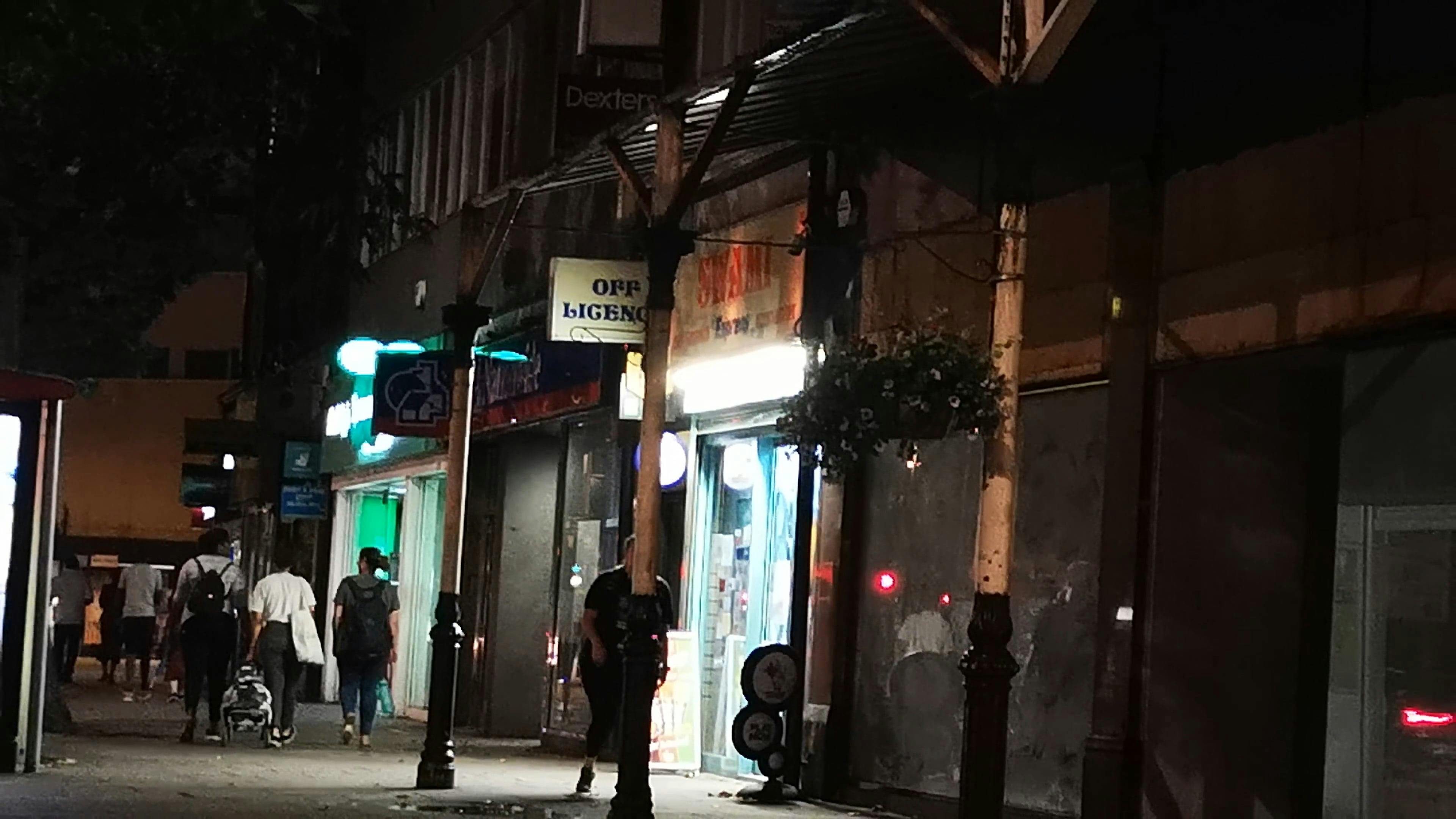 People Walking through Pavement in front of Stores · Free Stock Video