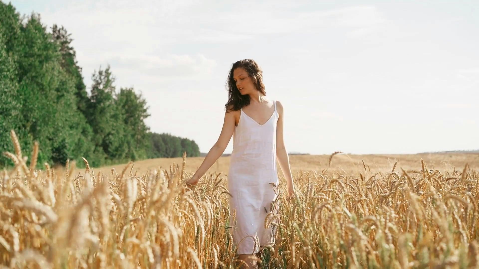 A Woman Walking in a Field · Free Stock Video