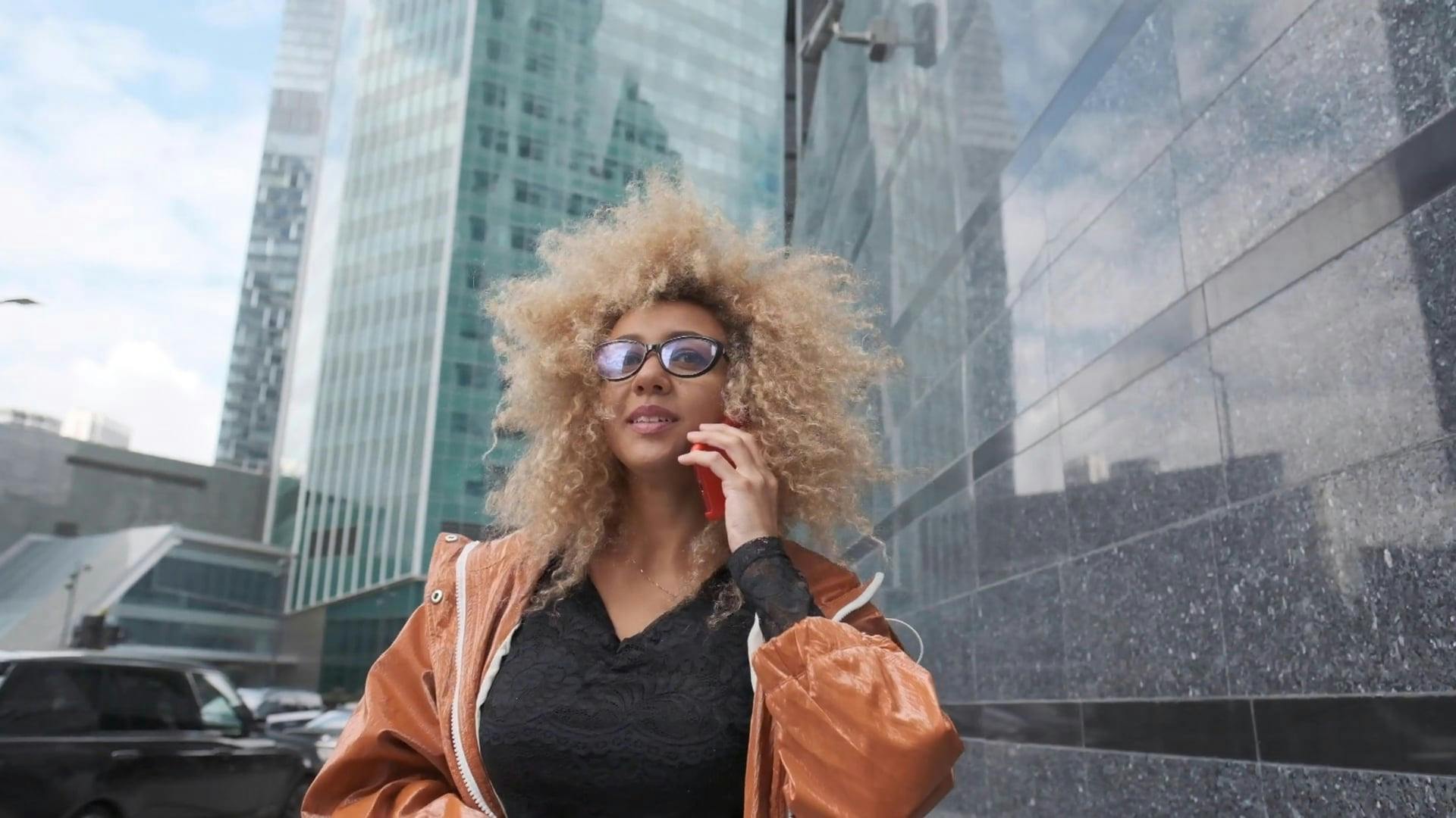 A Woman Having a Phone Call while Walking Backwards Free Stock Video ...