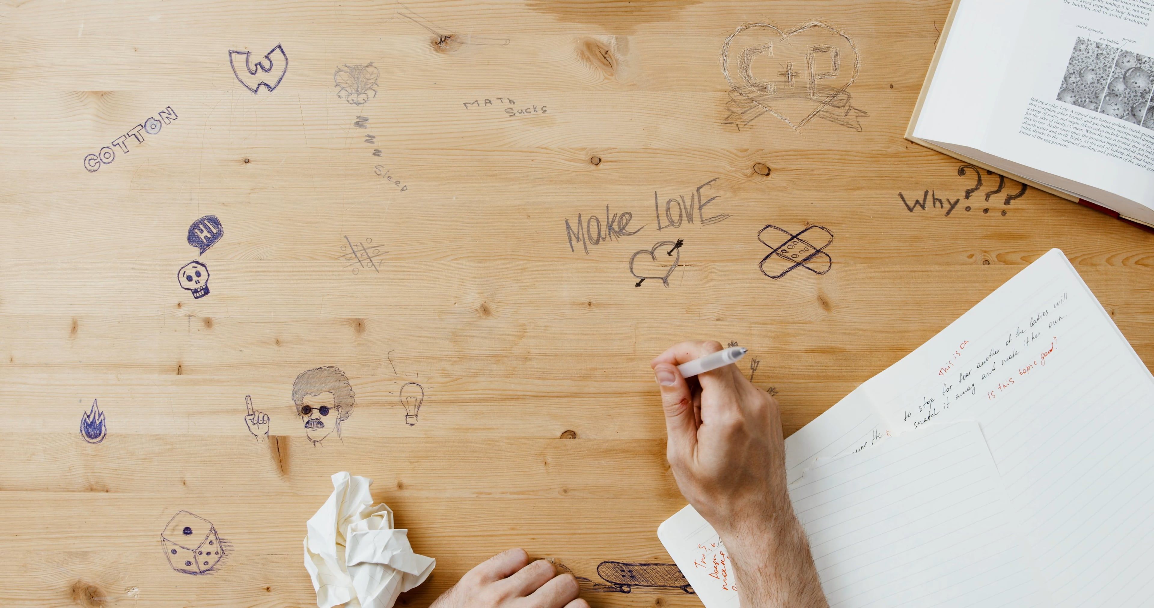 Person Drawing on the Table · Free Stock Video