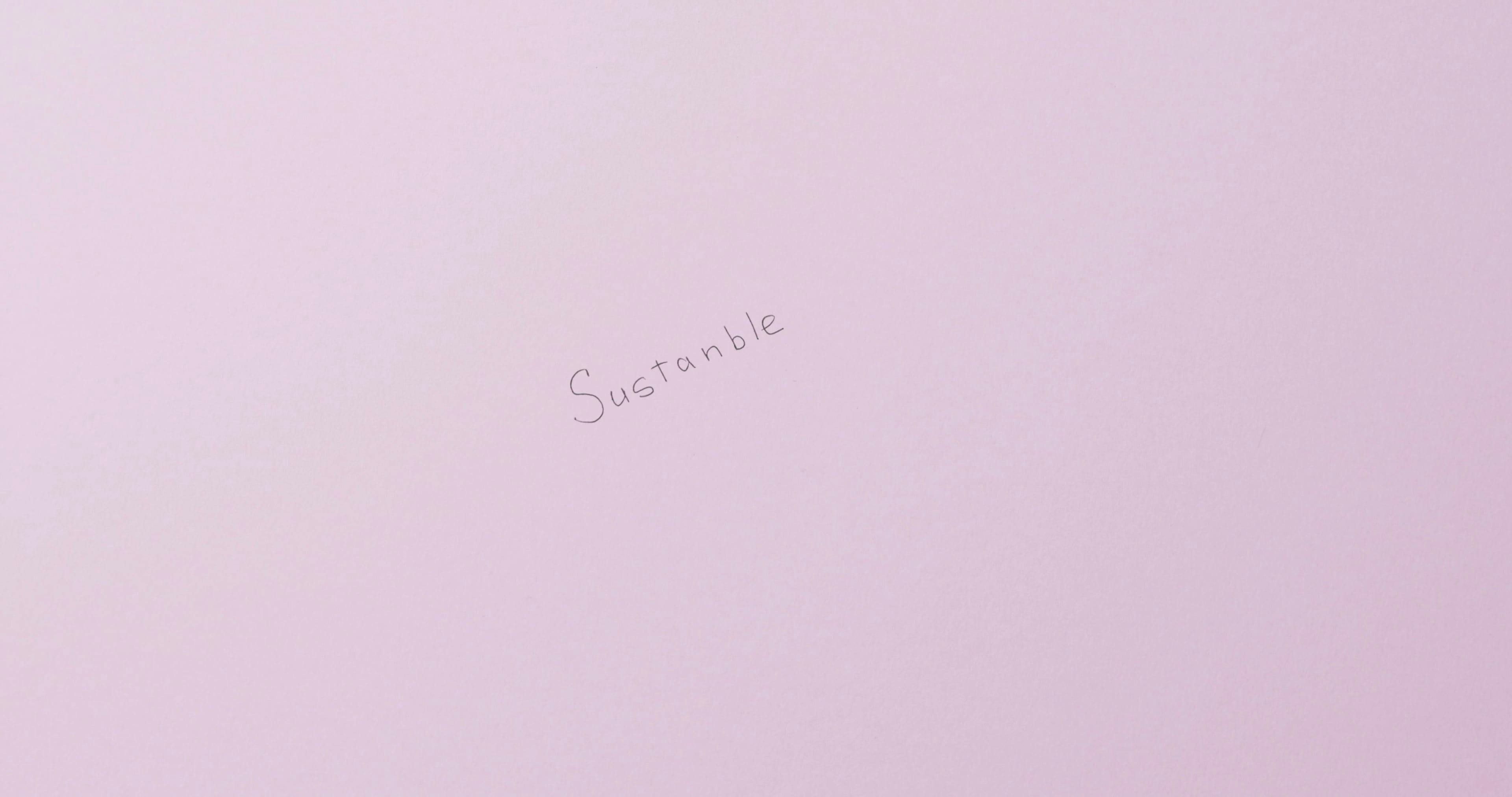 A Person Writing on Pink Paper · Free Stock Video