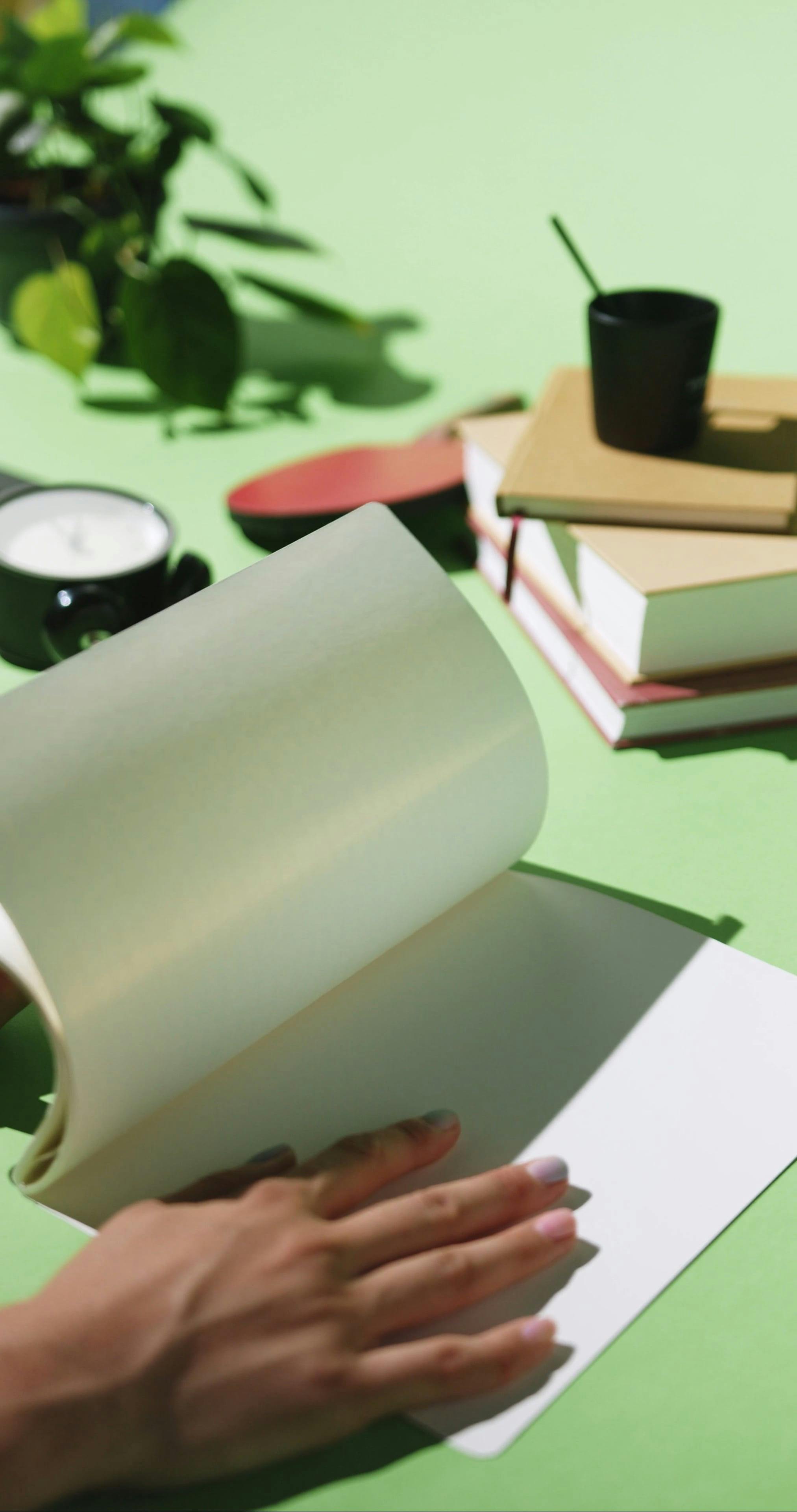 Man Turning Pages of a Notebook · Free Stock Video