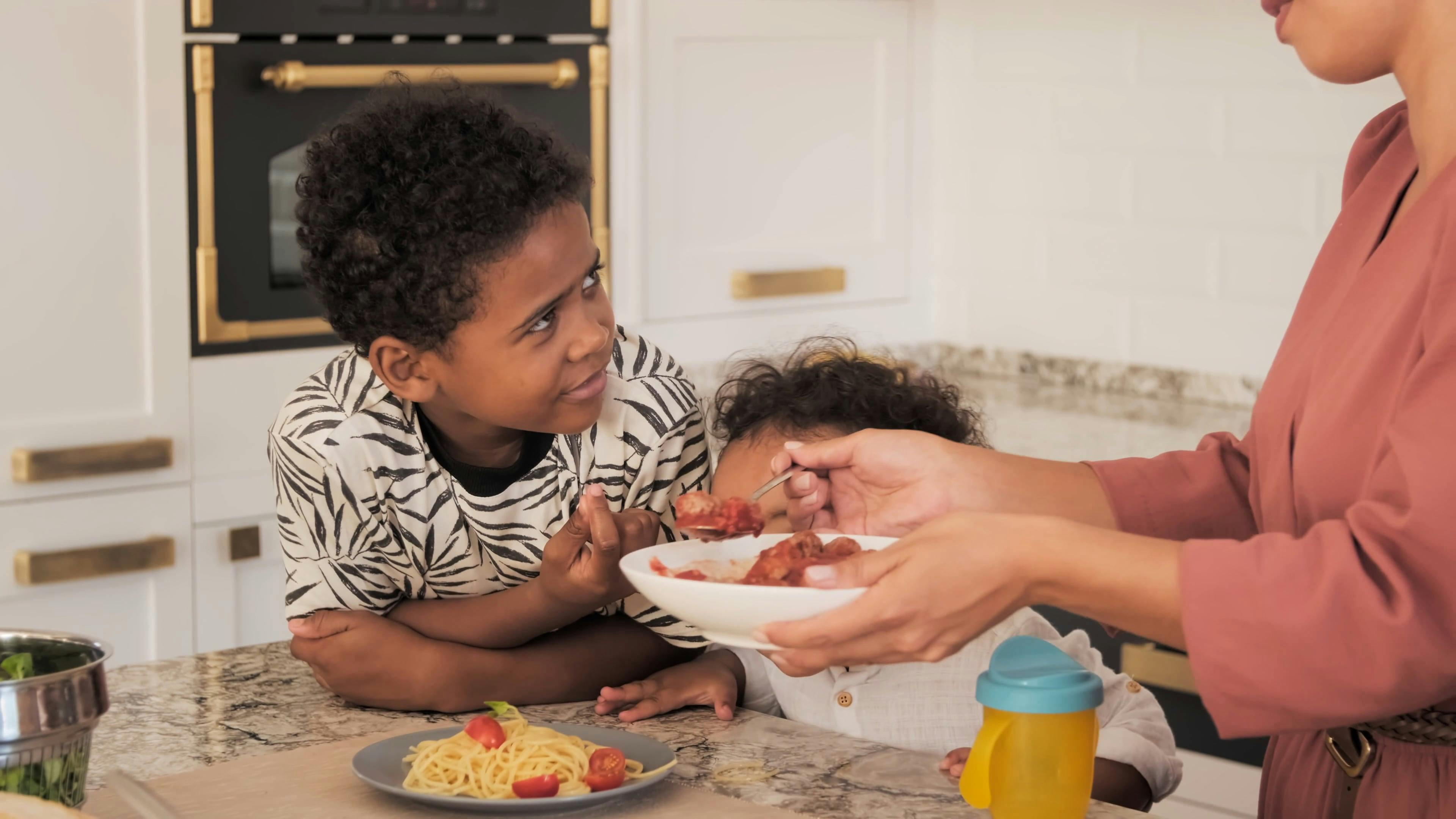 A Child Pushing a Plate Away from Him · Free Stock Video