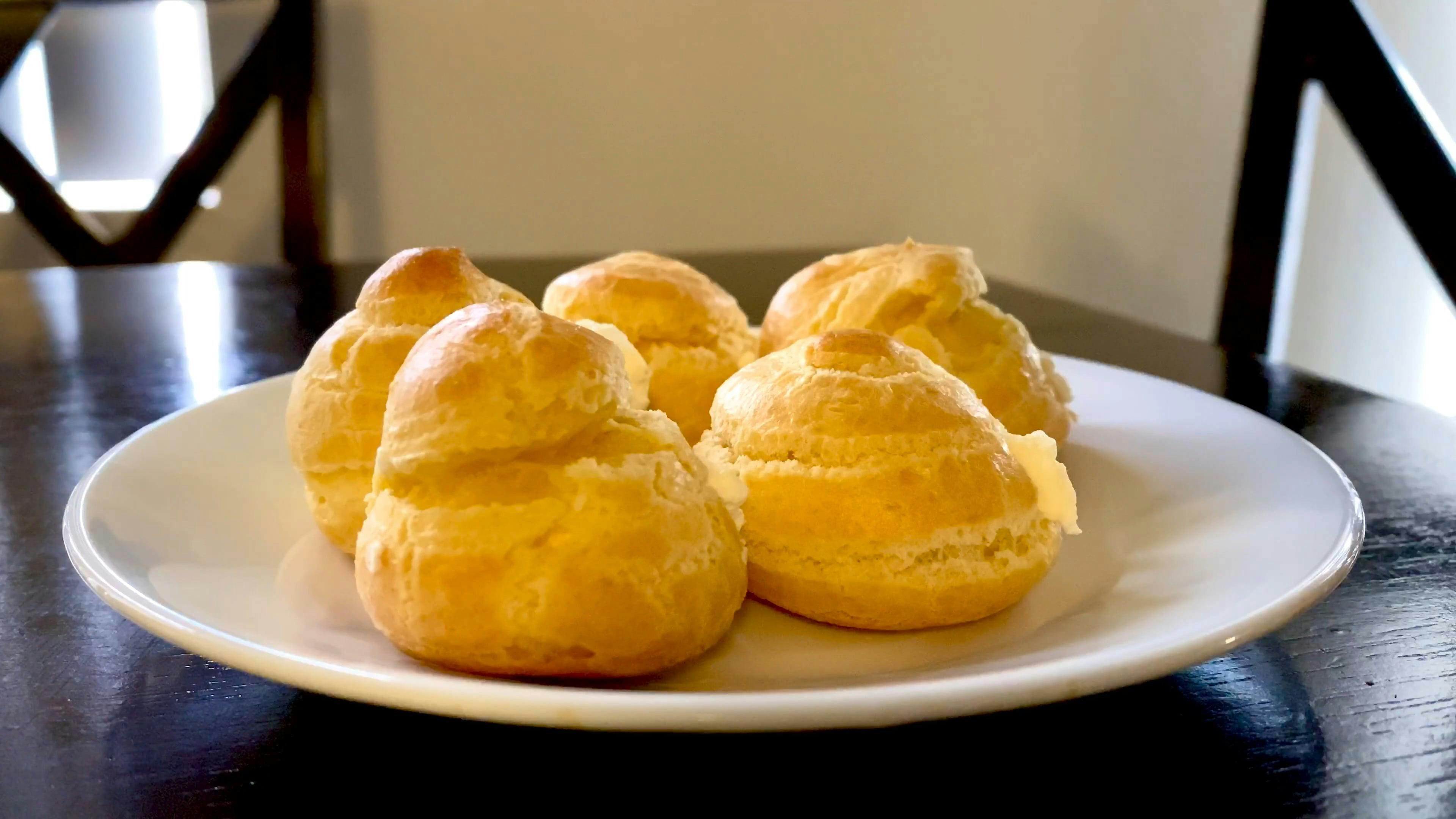 Mouthwatering Cream Puffs on a Plate · Free Stock Video