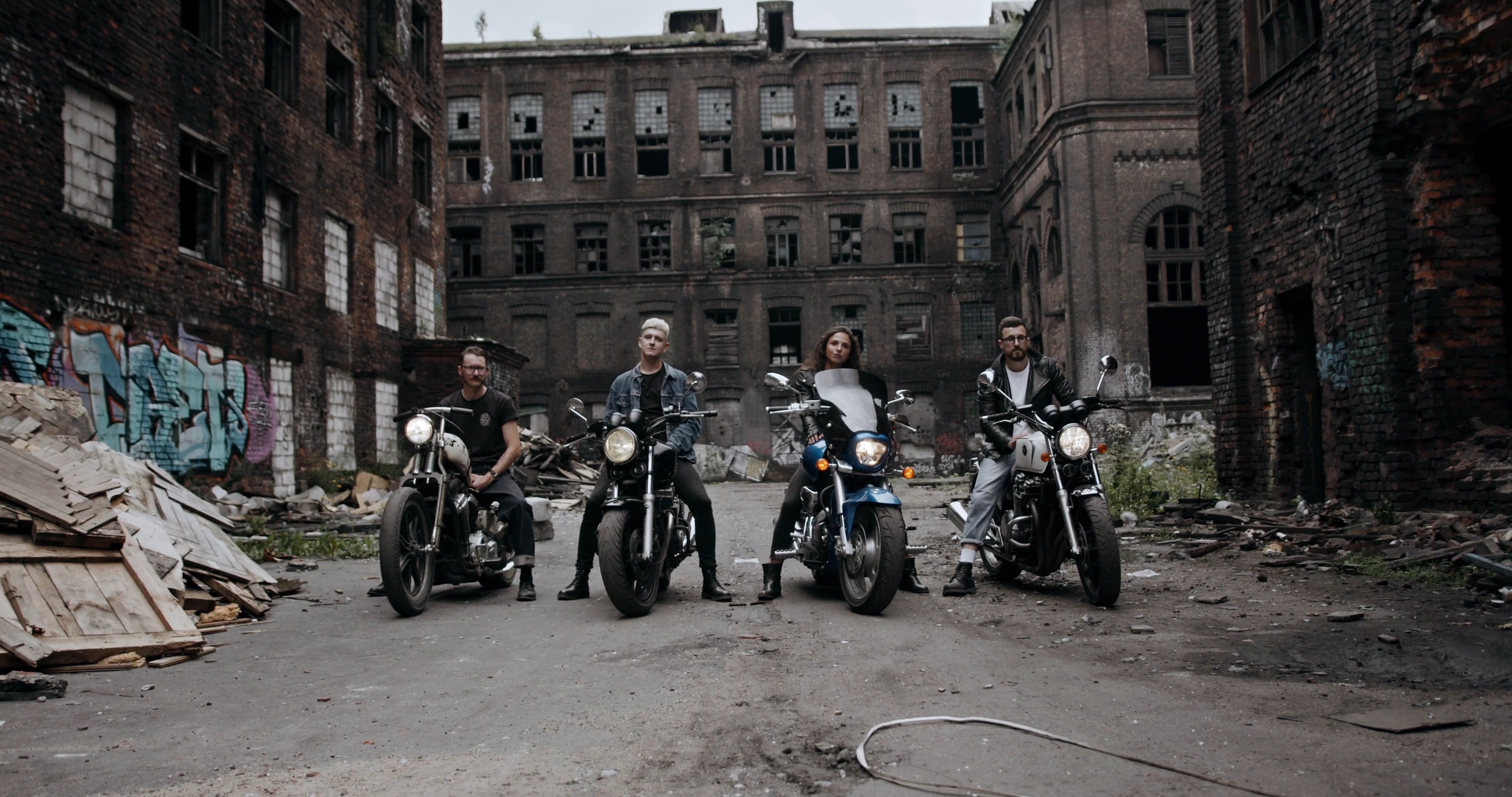 Four Bikers Posing with their Motorbikes · Free Stock Video