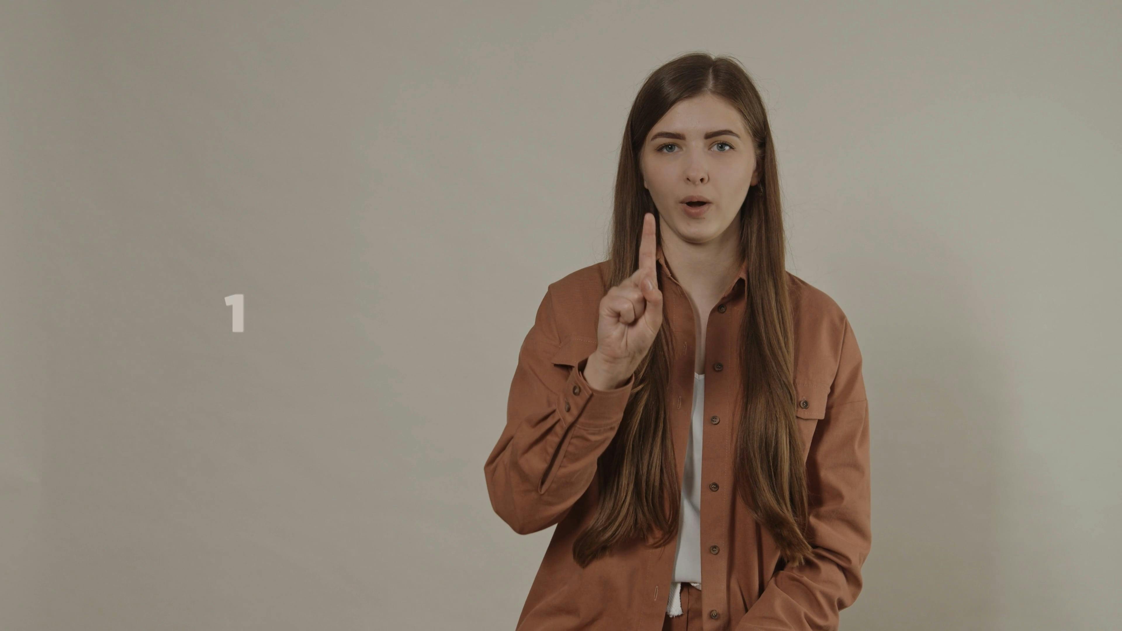 Woman Counting 1 to 10 by Doing Sign Language · Free Stock Video