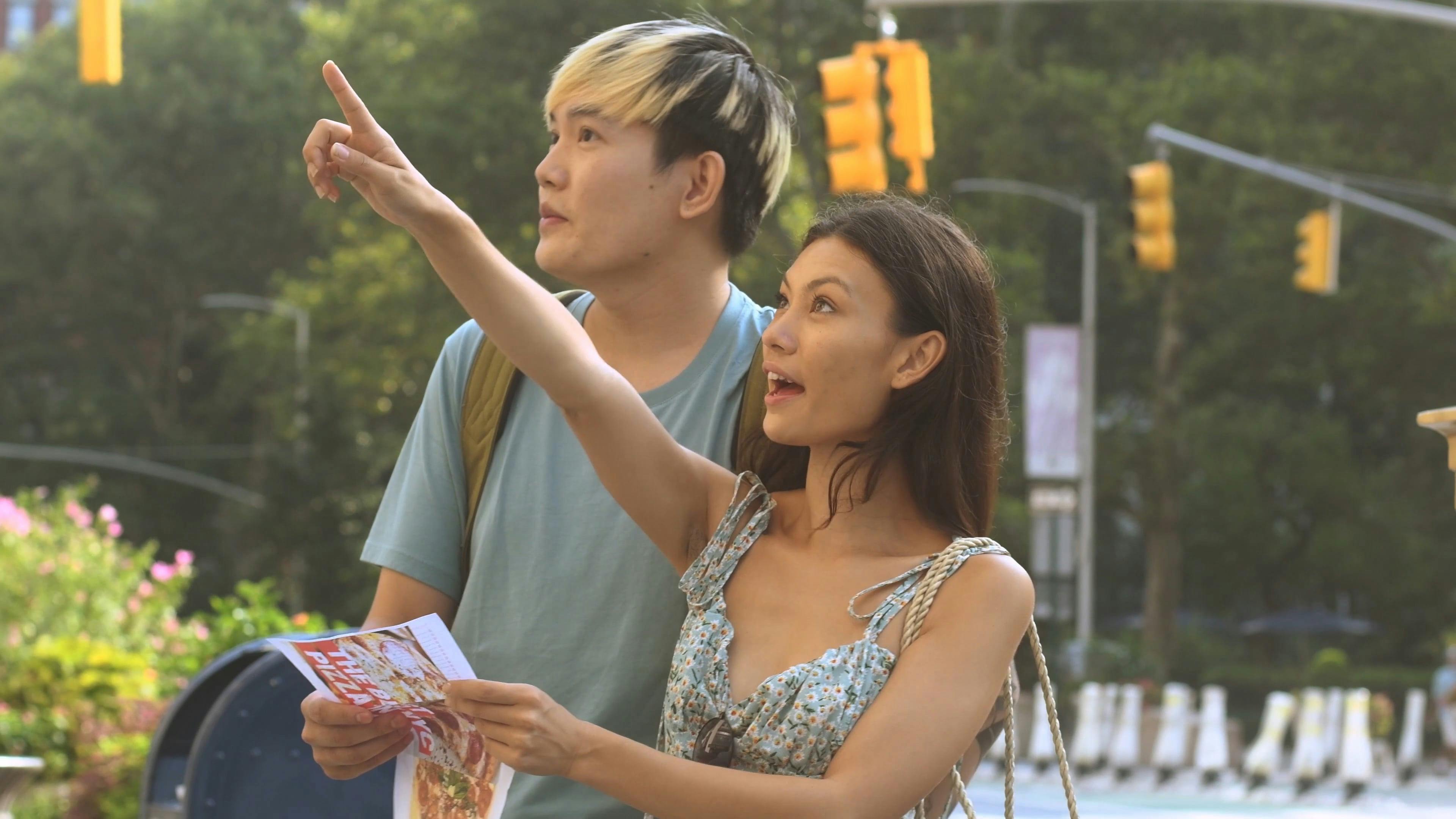 Two People Looking For Directions · Free Stock Video