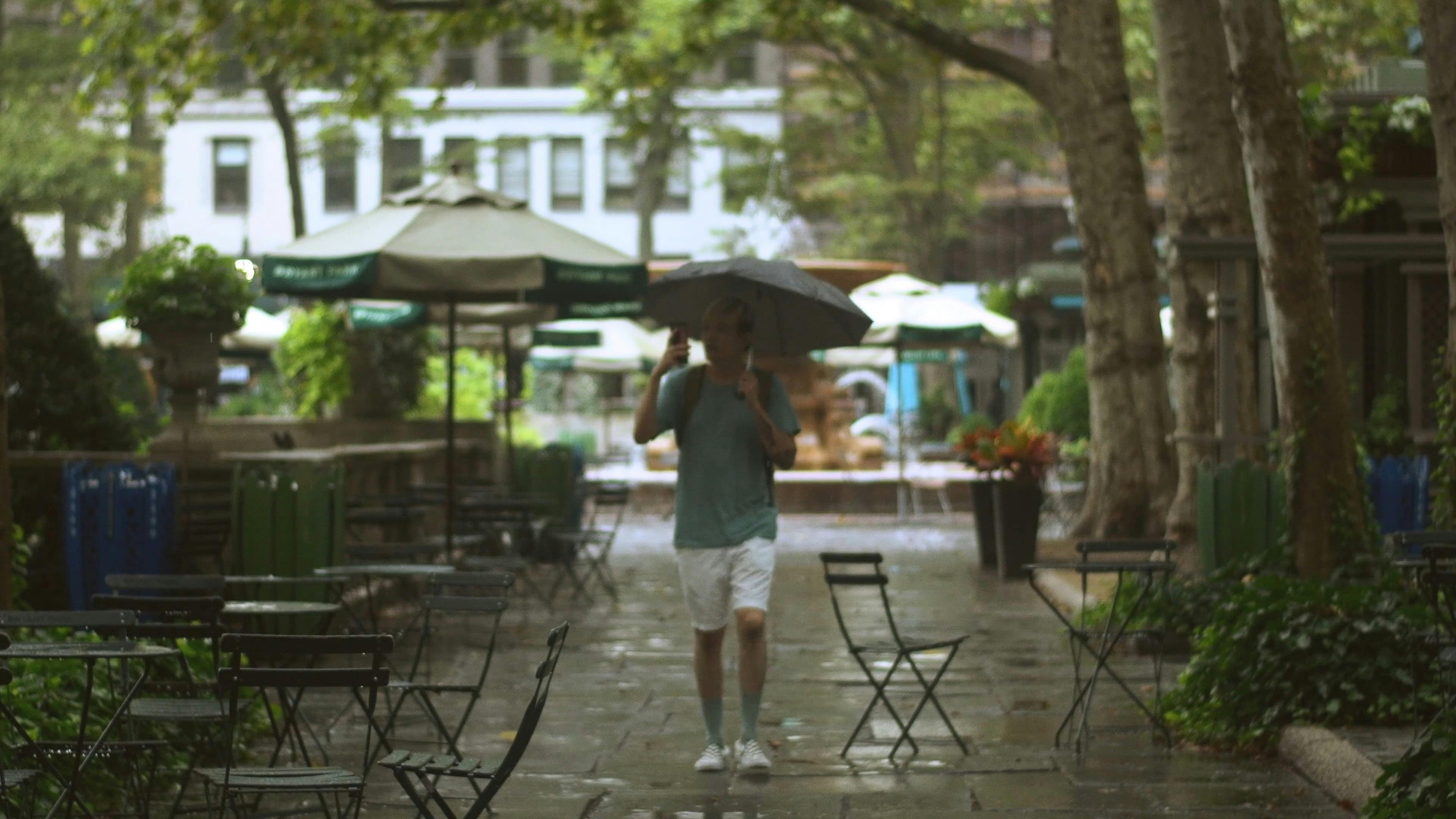 Man Walking Looking for Signal · Free Stock Video