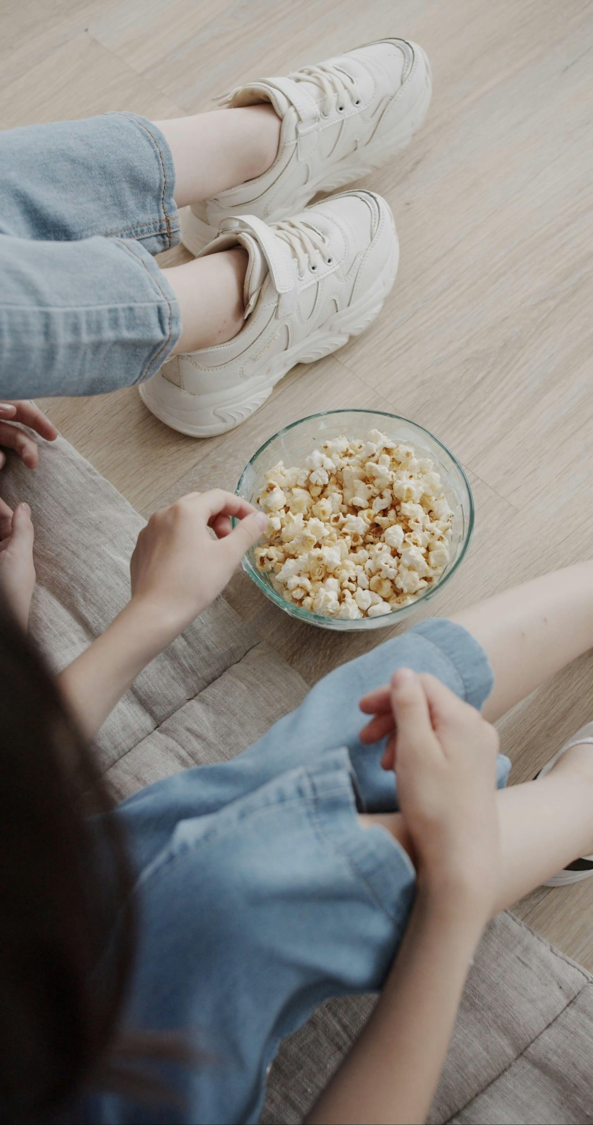 High-Angle Shot of Two People Eating Popcorn Free Stock Video Footage ...