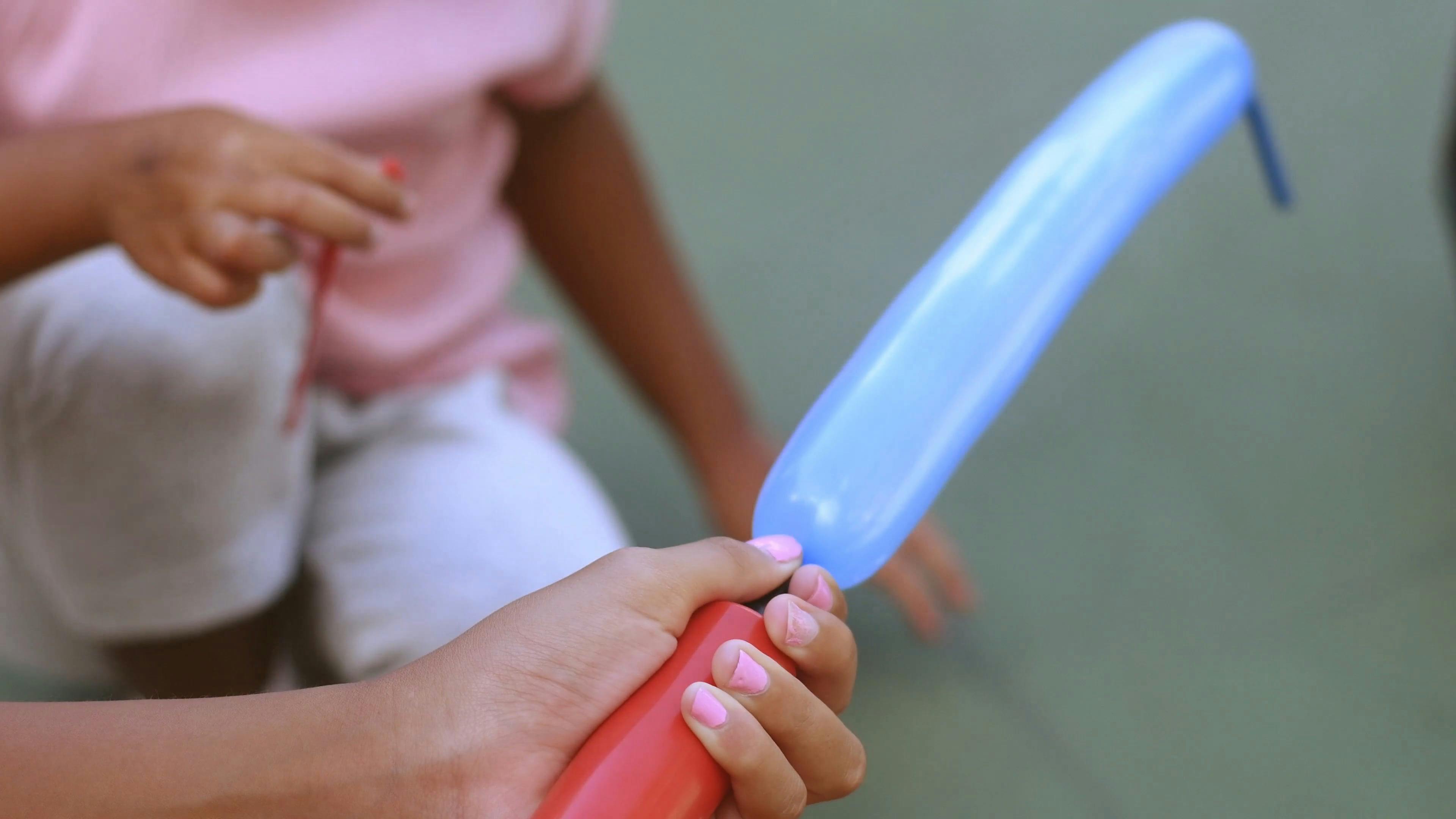 Girl Inflating Long Balloon Free Stock Video Footage, Royalty-Free 4K ...