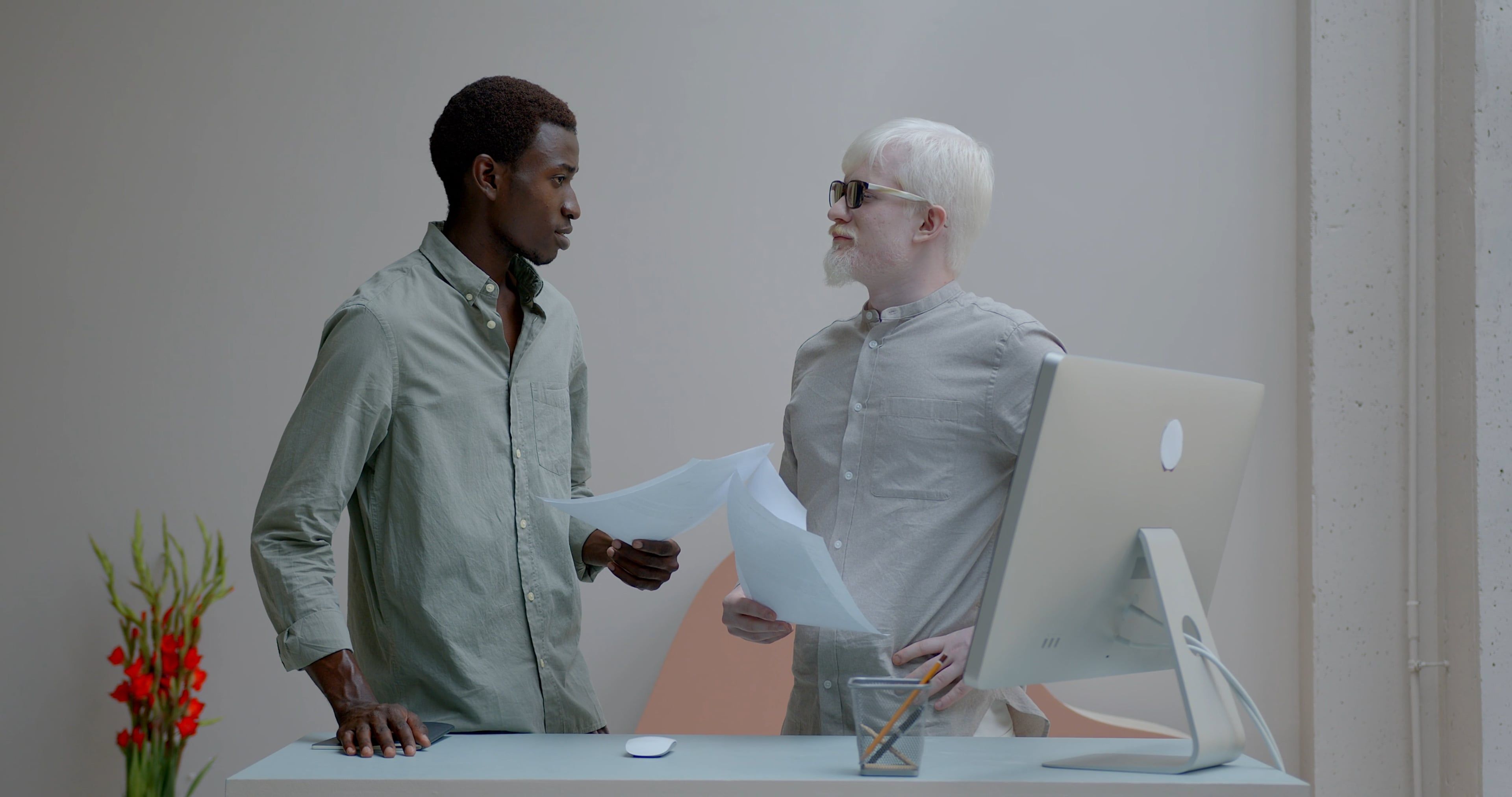 People Holding Papers Having a Conversation · Free Stock Video