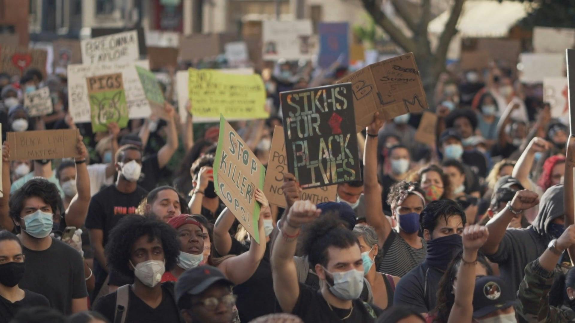 Enthusiastic Crowd Chanting Slogans Behind a Woman Speaker Free Stock ...