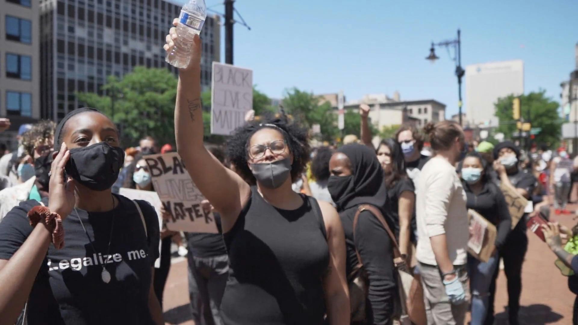Protesters Standing Outdoors while Holding Placards · Free Stock Video