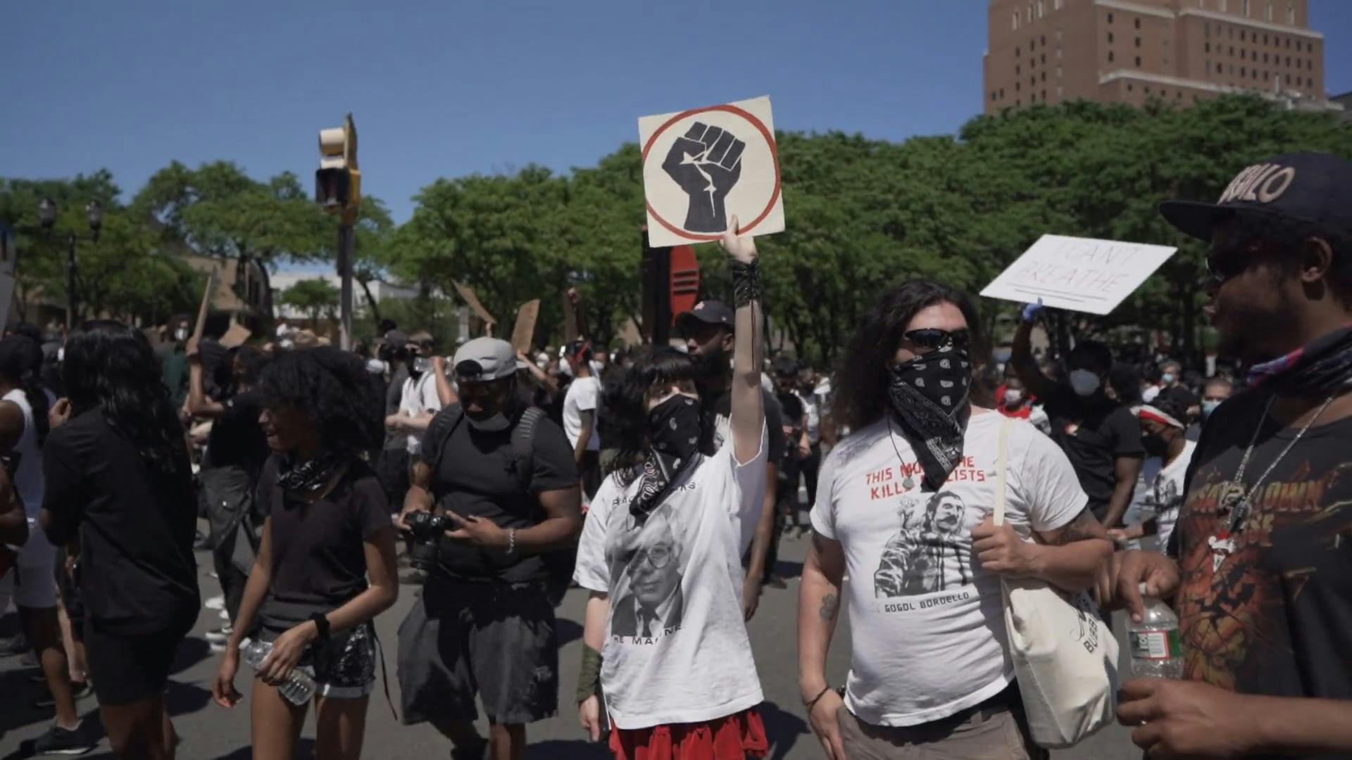 A Person Holding a Black Lives Matter Logo Poster · Free Stock Video