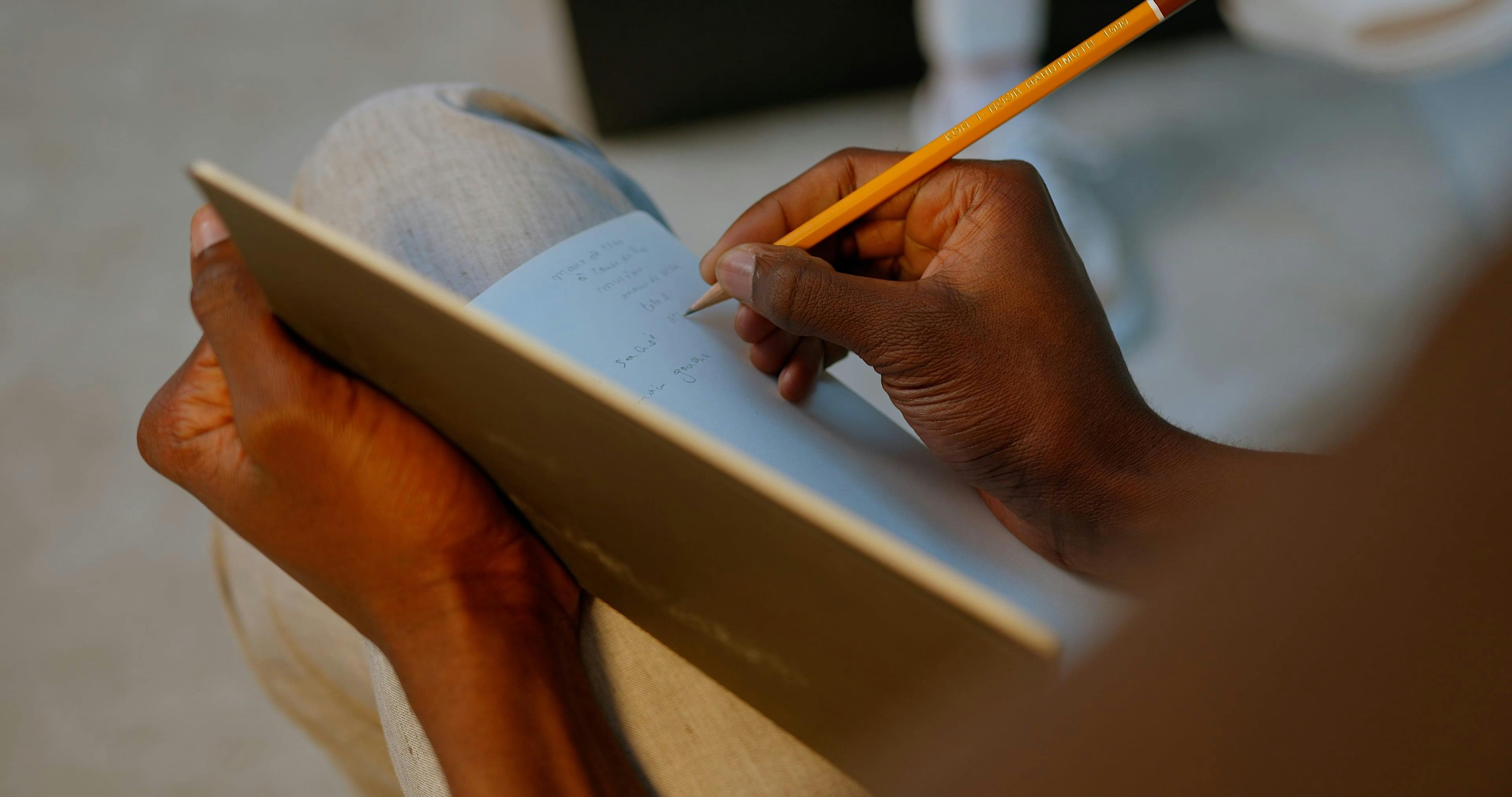 Writing And Erasing On A Sheet Of Paper · Free Stock Video