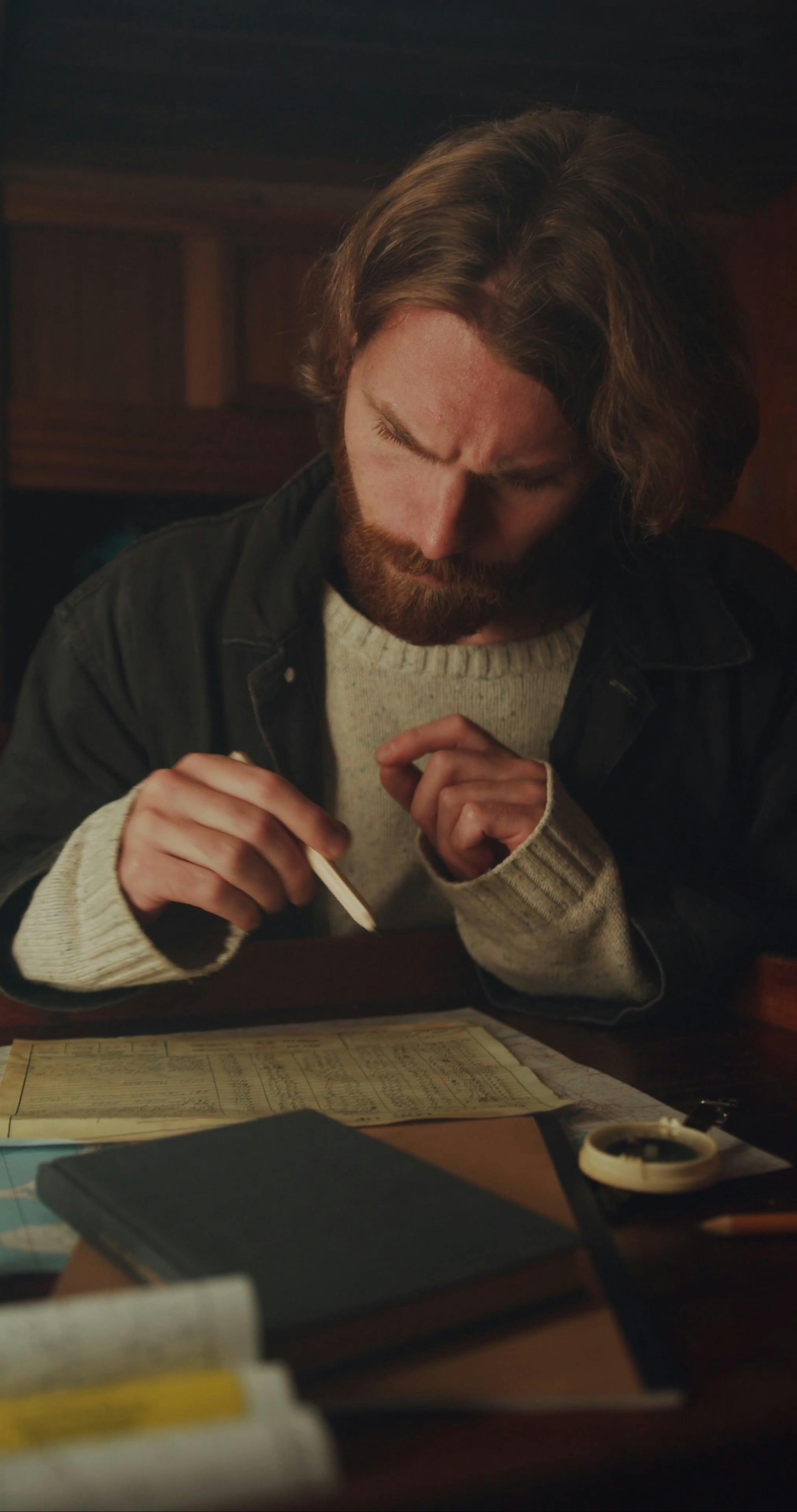 Man Writing on Paper · Free Stock Video