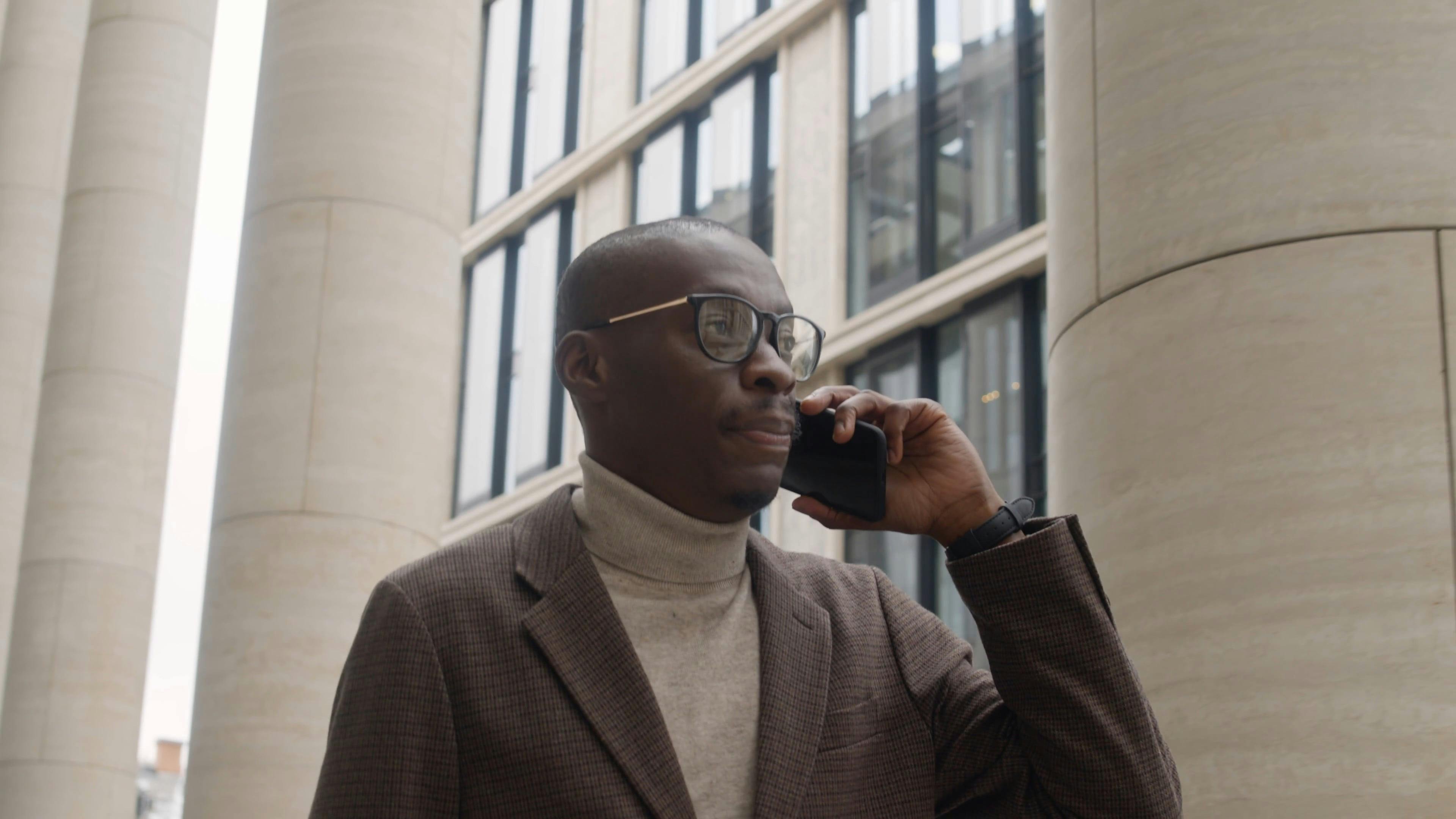 Low-Angle Shot of a Man Talking on Cellphone · Free Stock Video