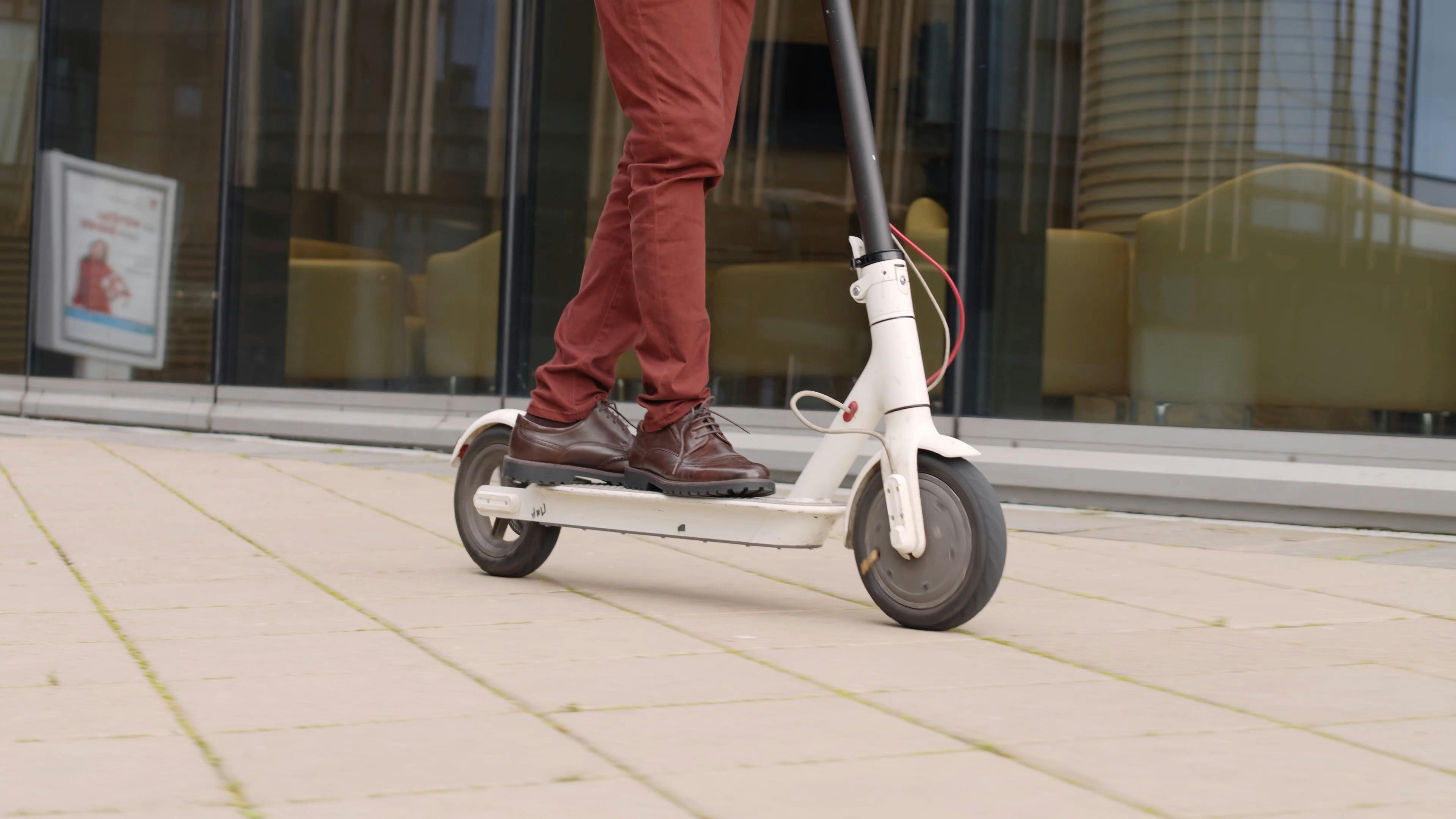 Close-Up View of a Person Riding a Scooter · Free Stock Video