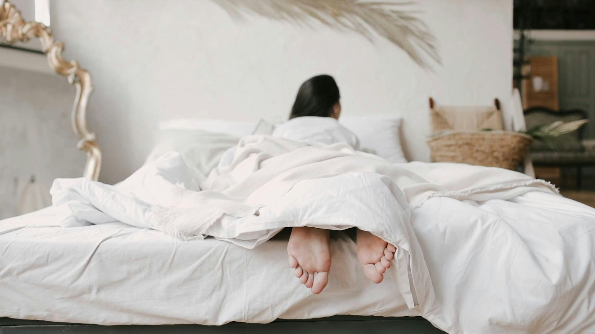 A Man Wrapping Himself in the Blanket and Falling Off Bed Free Stock ...