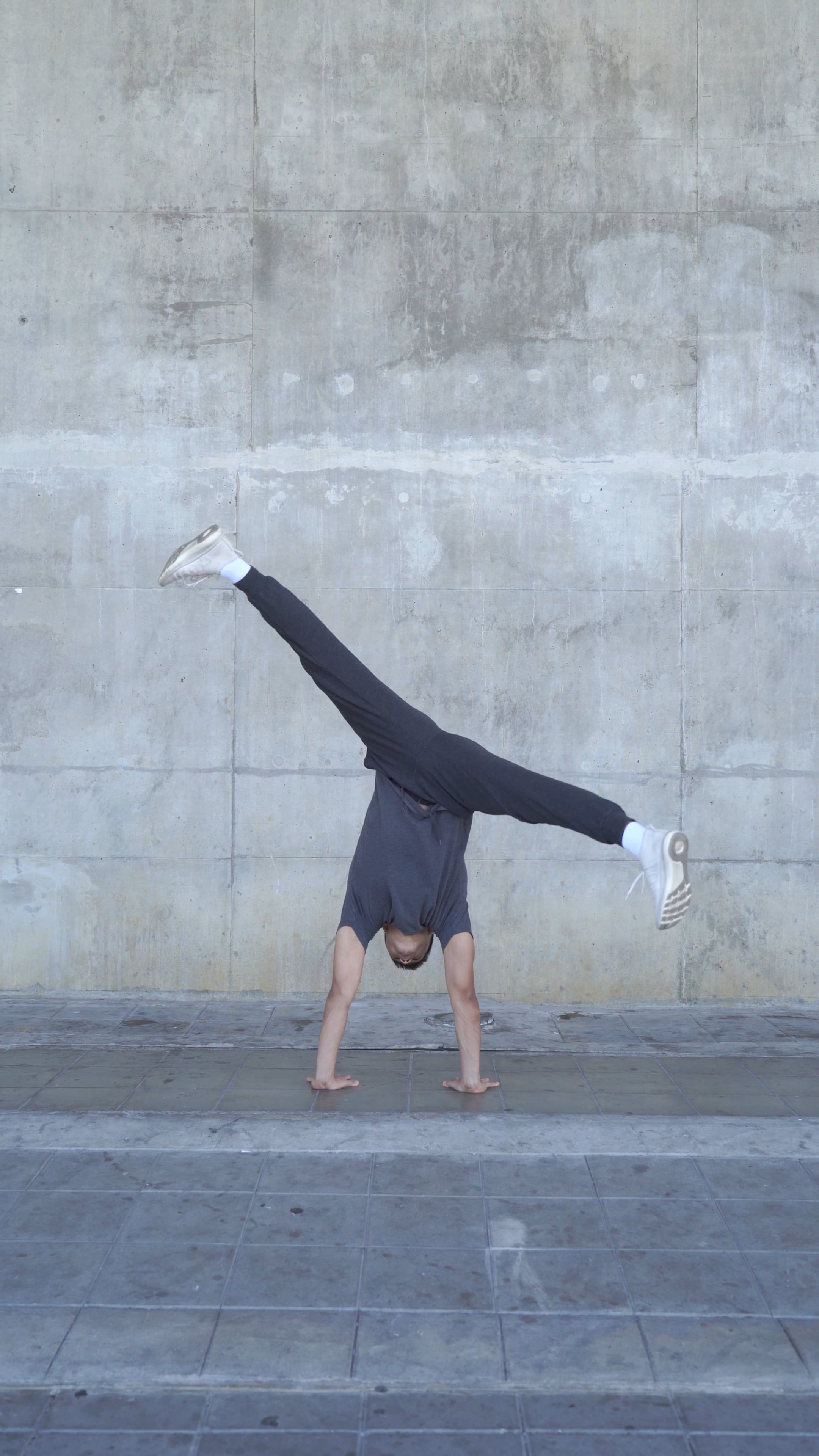 A Man Doing a Hand Stand · Free Stock Video