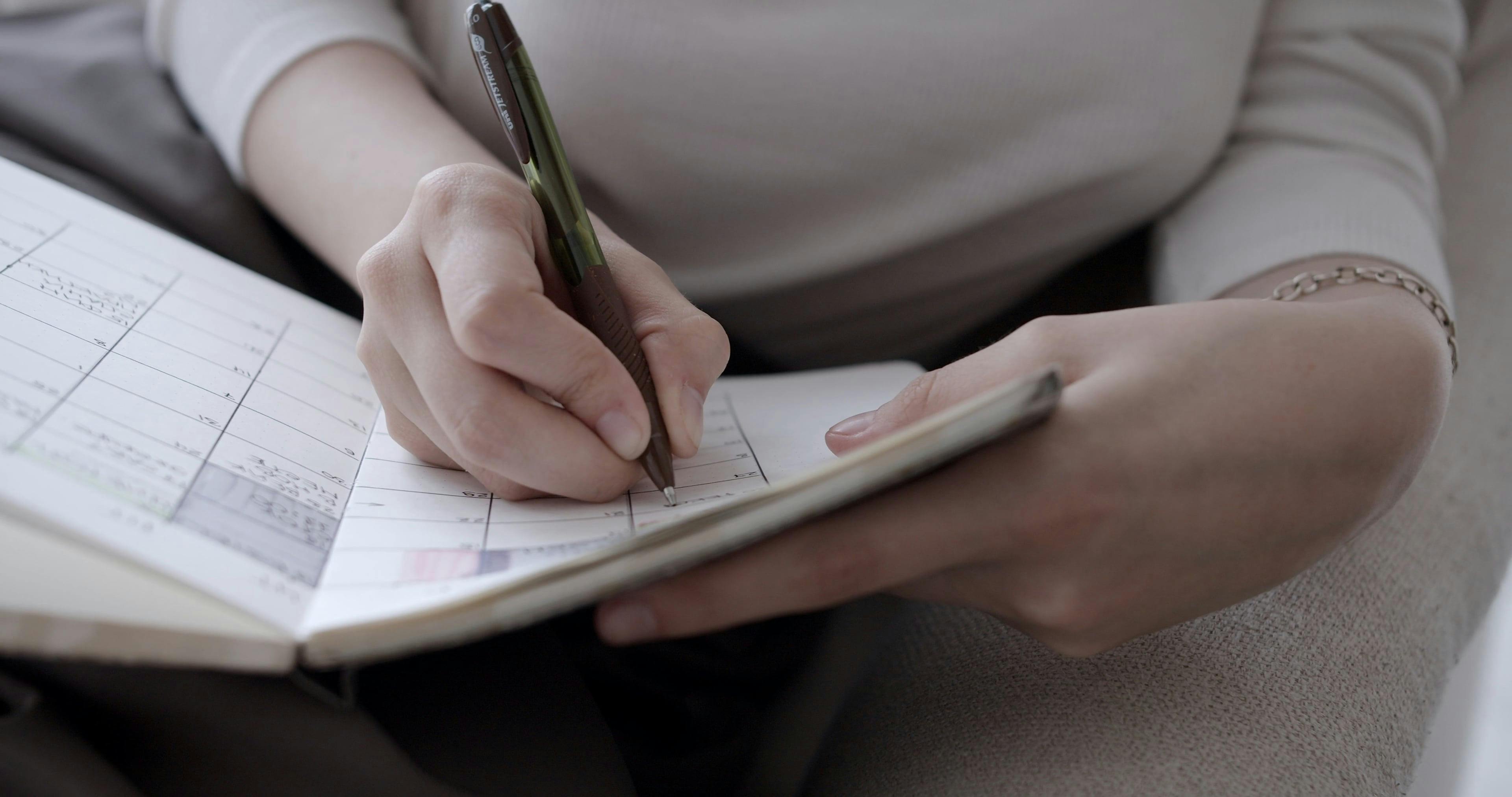 Person Writing on a Planner Free Stock Video Footage, Royalty-Free 4K ...