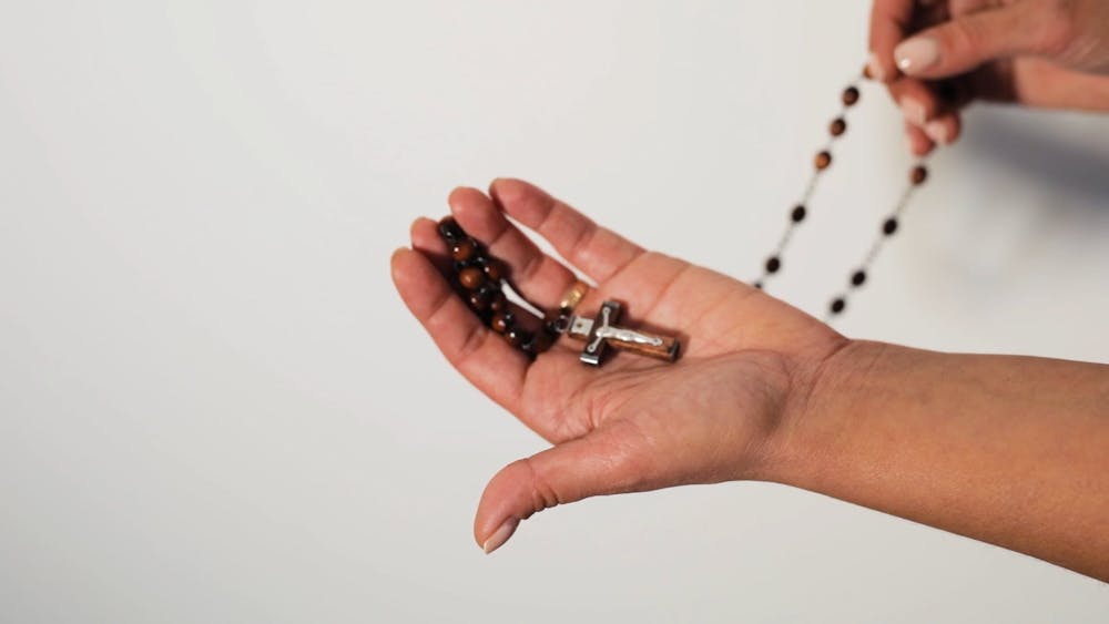 Young Woman Praying With Rosary · Free Stock Video