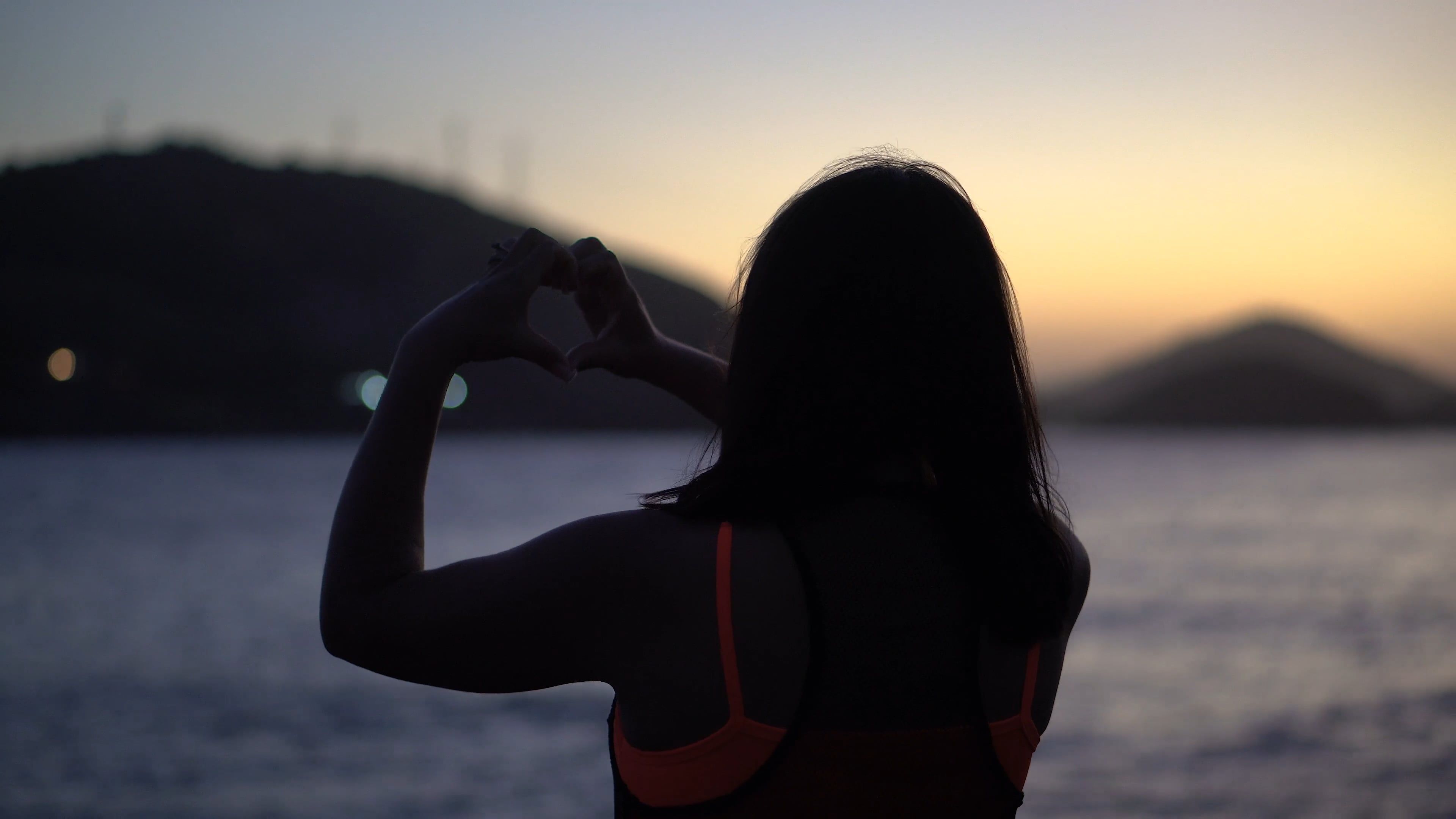 Young Woman Making Heart Shape with Hands Free Stock Video Footage ...