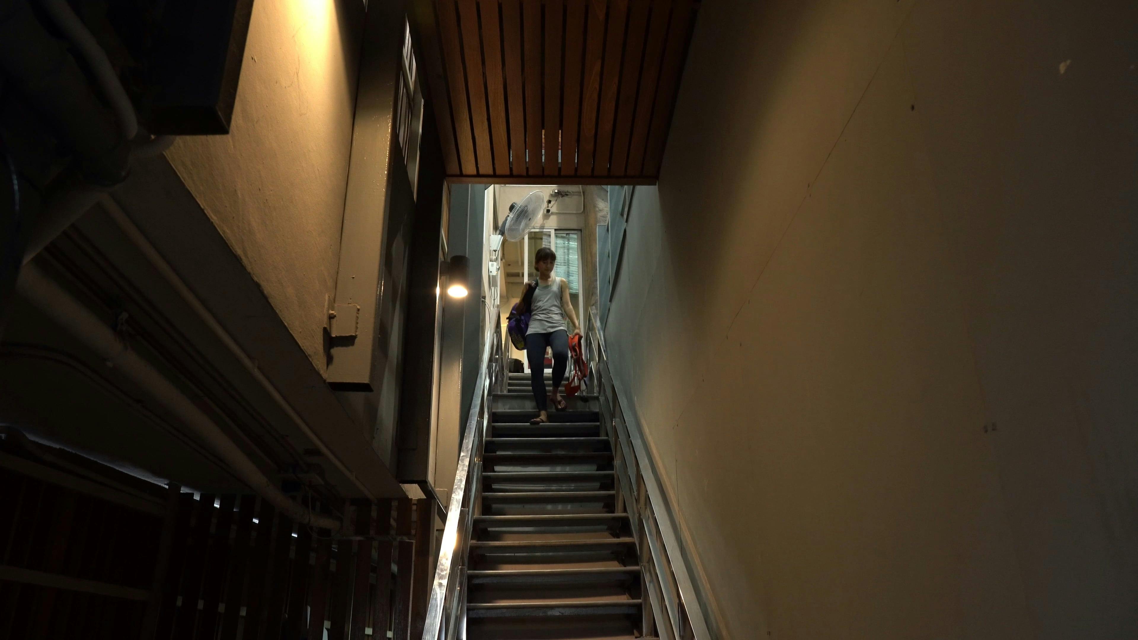 A Woman Walking Down Stairs Free Stock Video Footage, Royalty-Free 4K ...